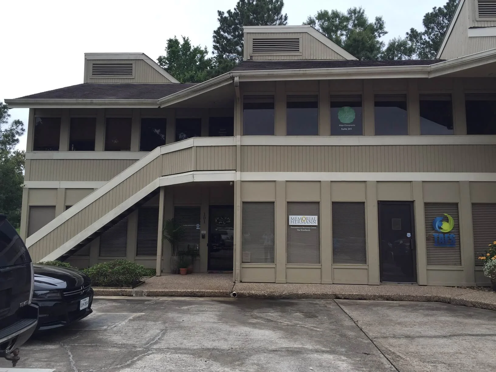 An Office Building's Dated Exterior Colors Are Reborn Into A Dark ...