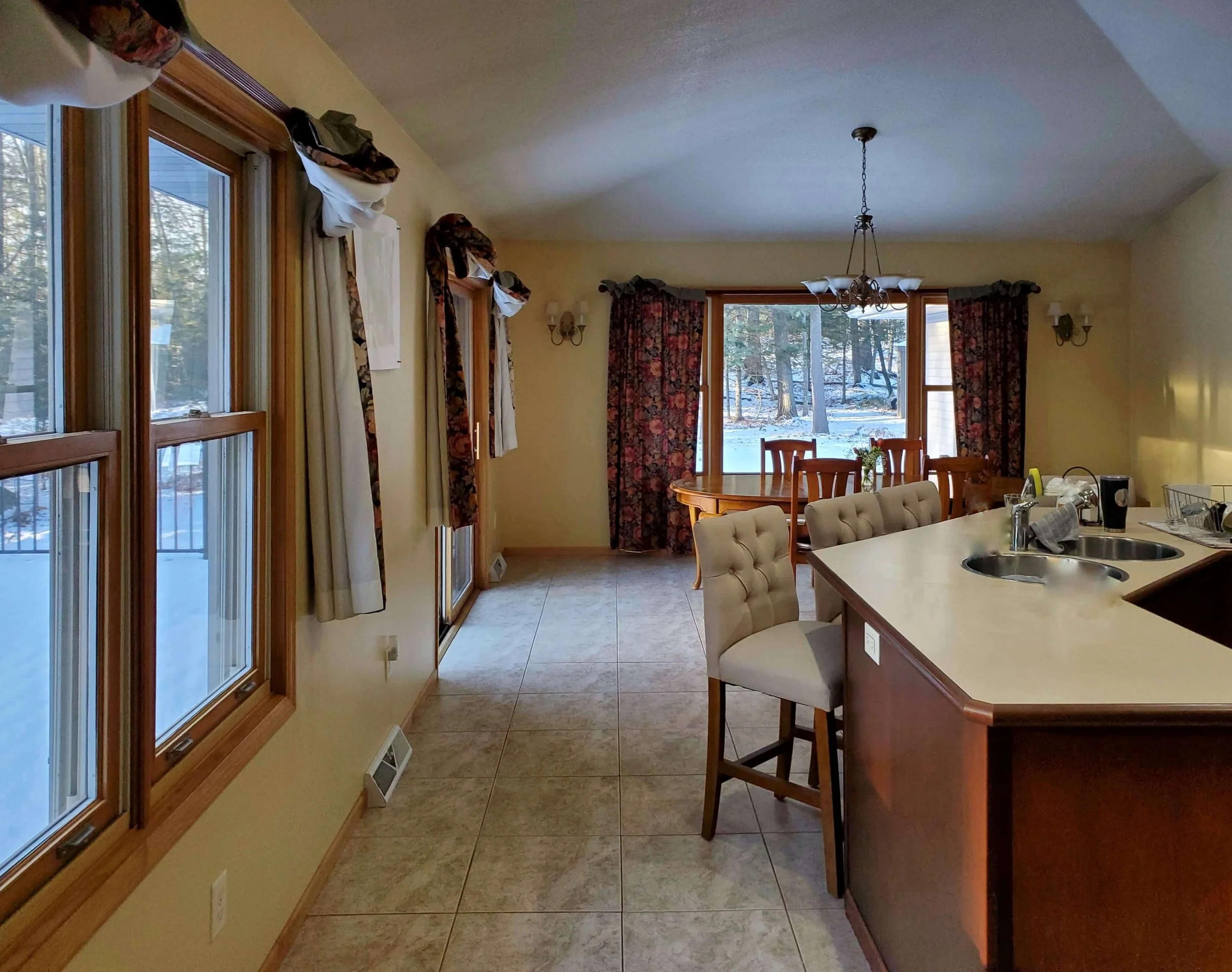 A Dining Room Open to the Kitchen is Designed with an Elevated Look ...