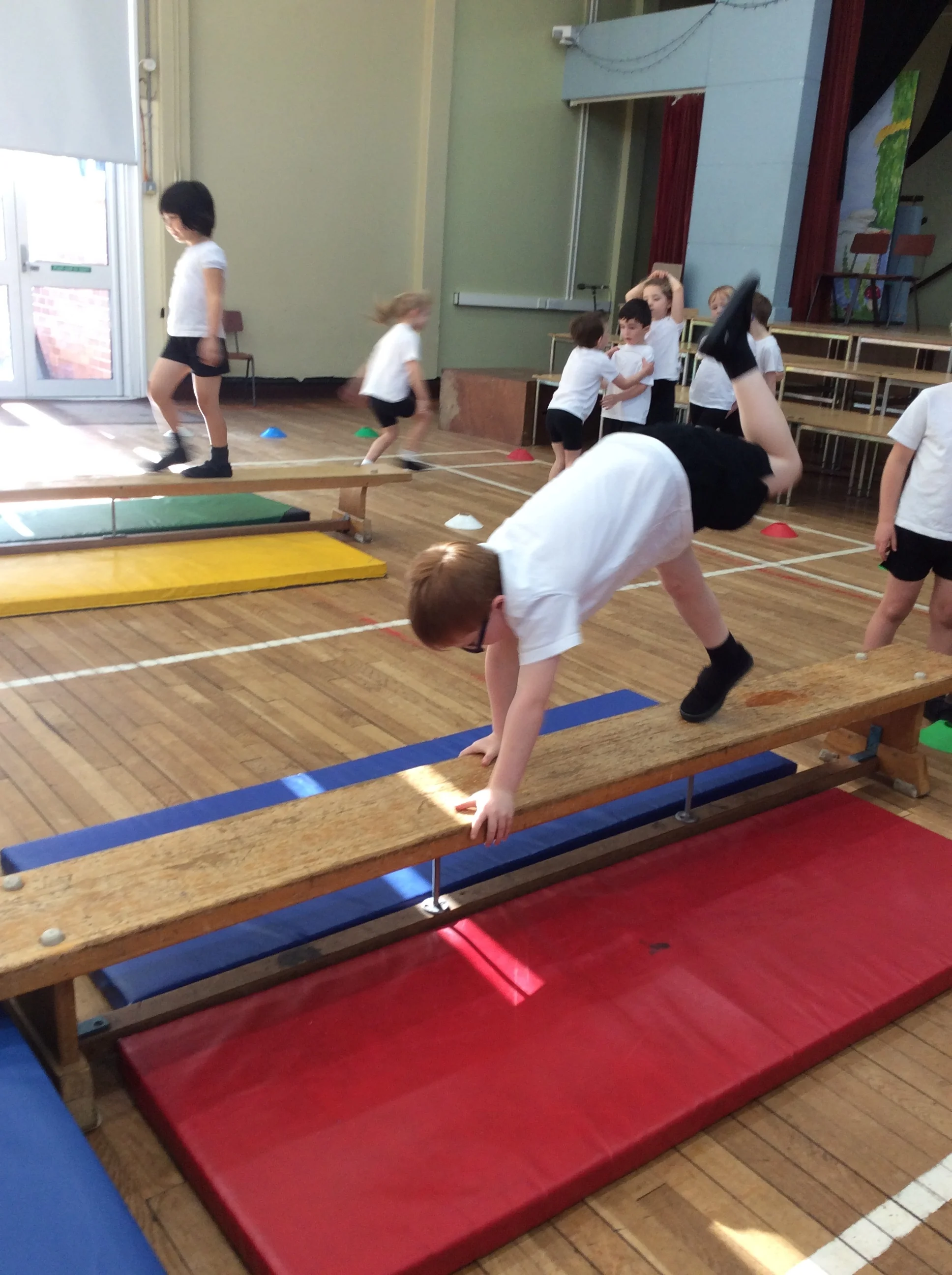 P2 are loving using the gymnastics equipment! — Holywood Primary School