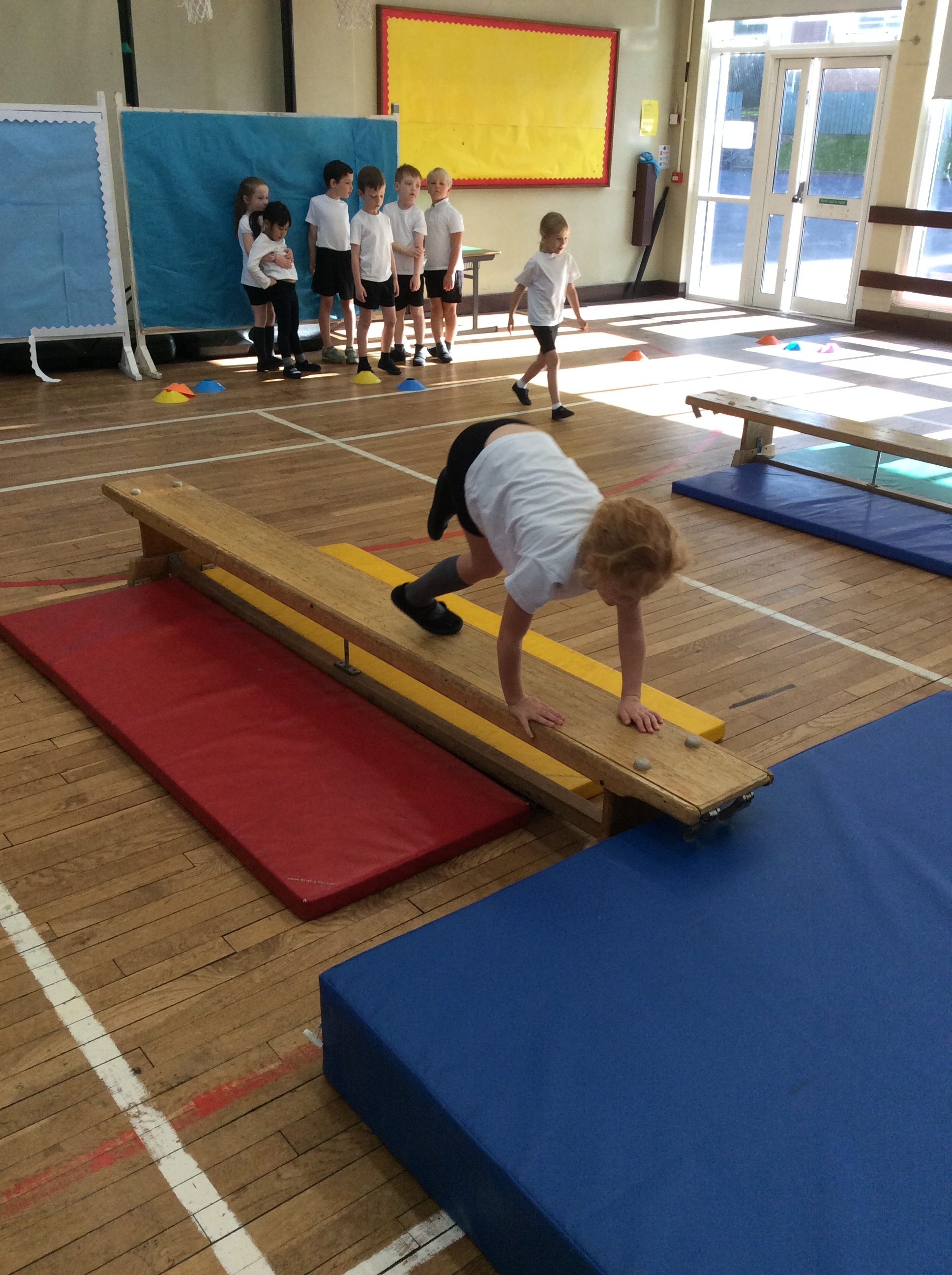 P2 are loving using the gymnastics equipment! — Holywood Primary School