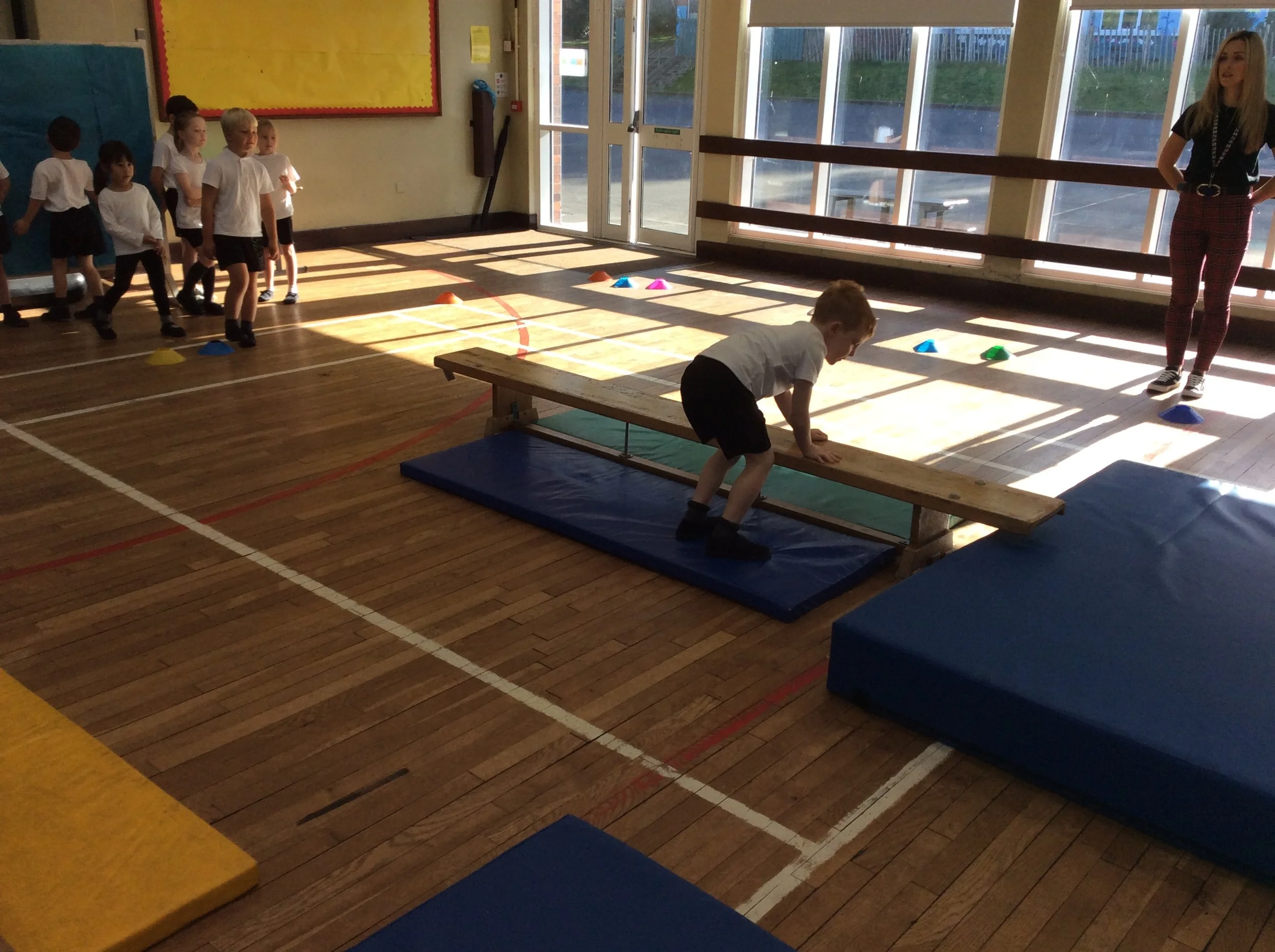 P2 are loving using the gymnastics equipment! — Holywood Primary School