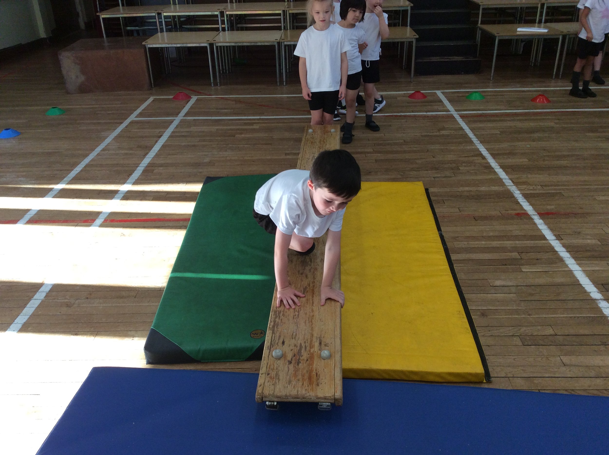 P2 are loving using the gymnastics equipment! — Holywood Primary School