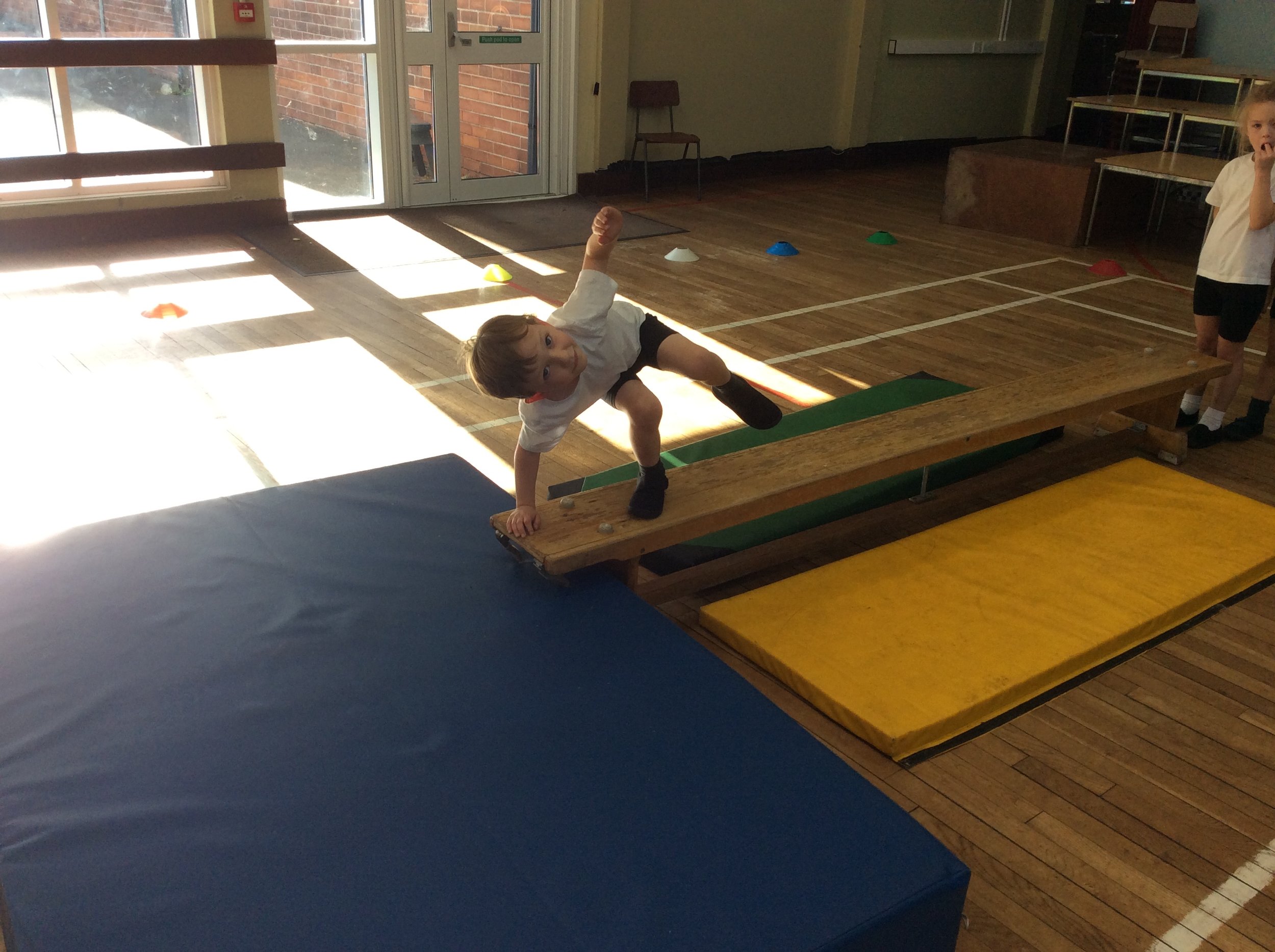 P2 are loving using the gymnastics equipment! — Holywood Primary School