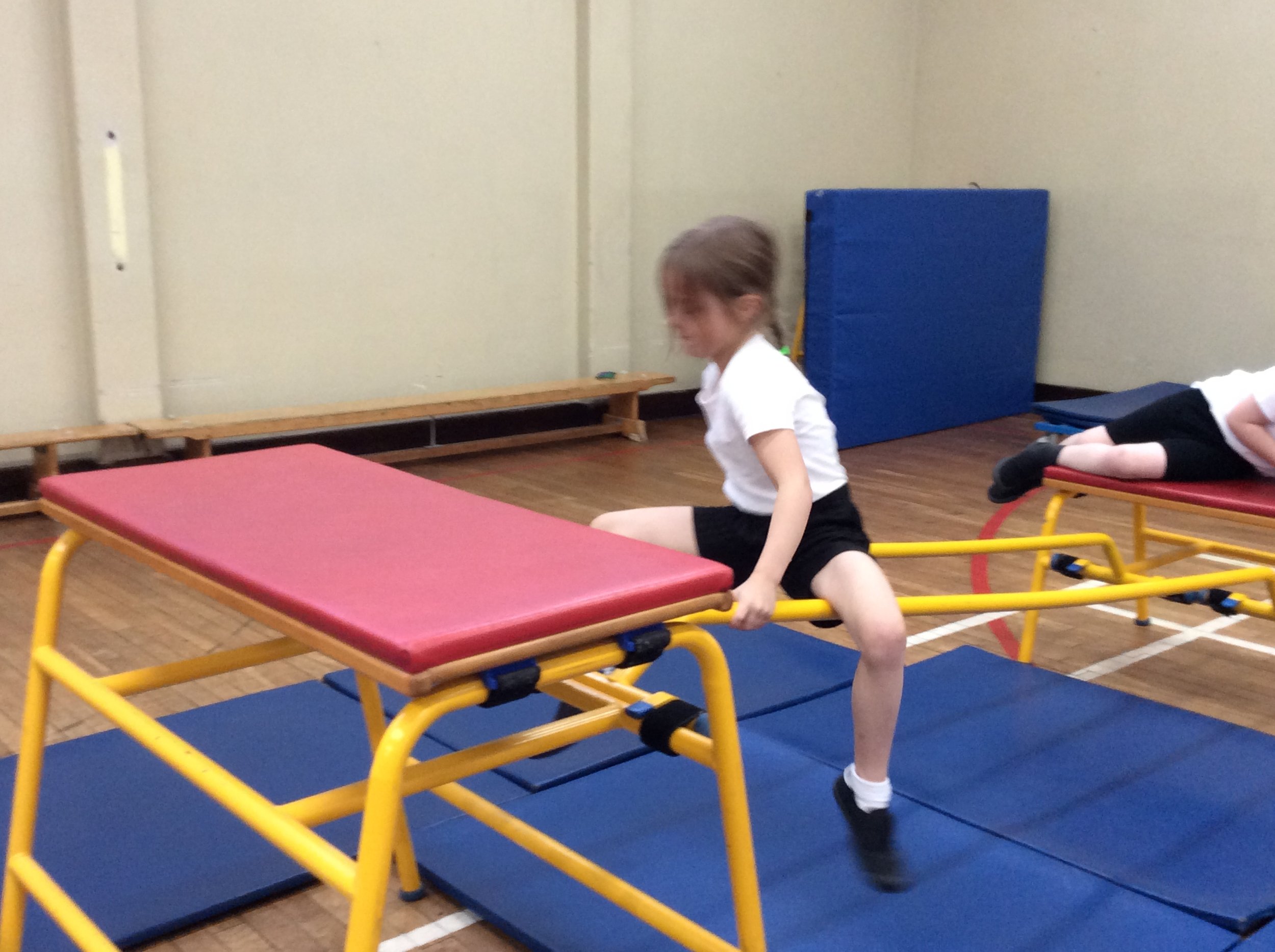 P2 are loving using the gymnastics equipment! — Holywood Primary School