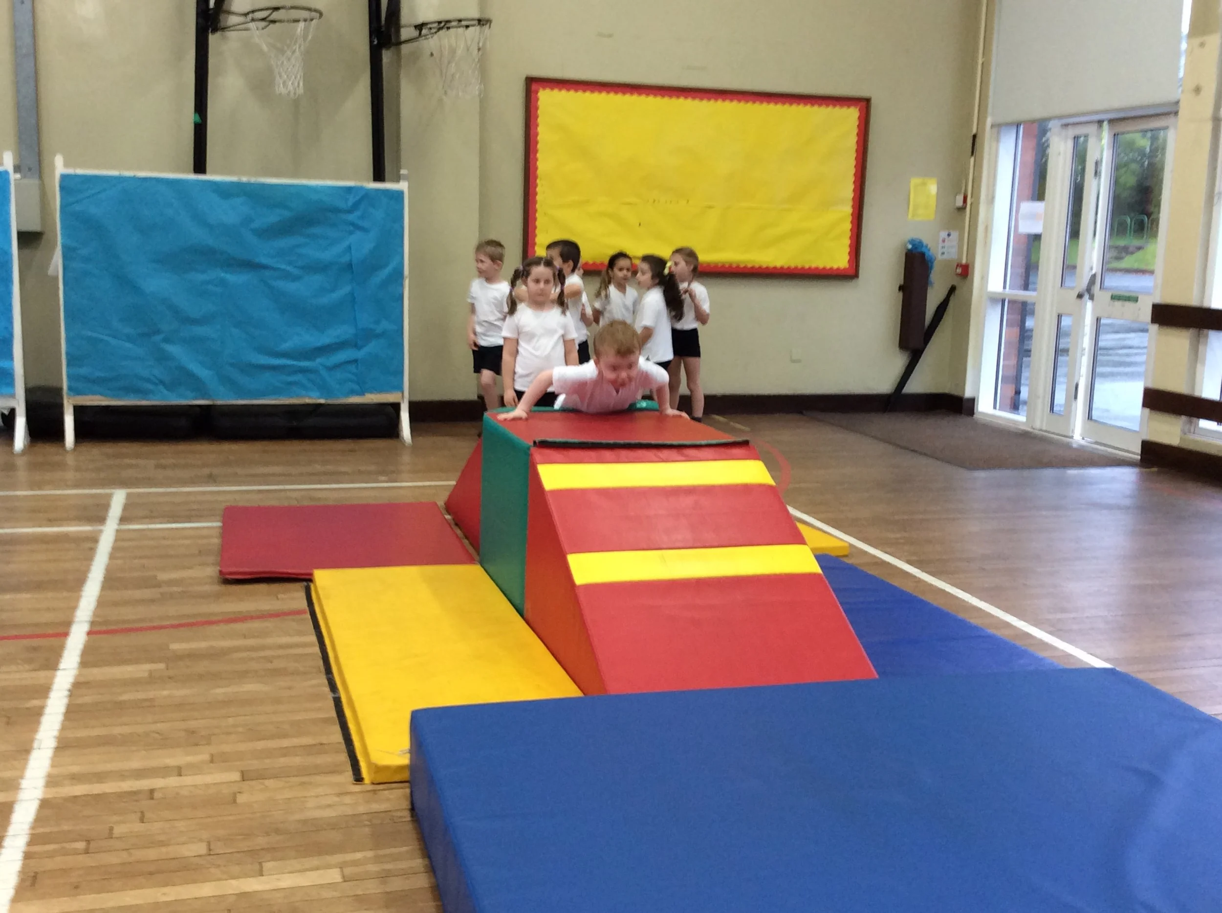 P2 are loving using the gymnastics equipment! — Holywood Primary School