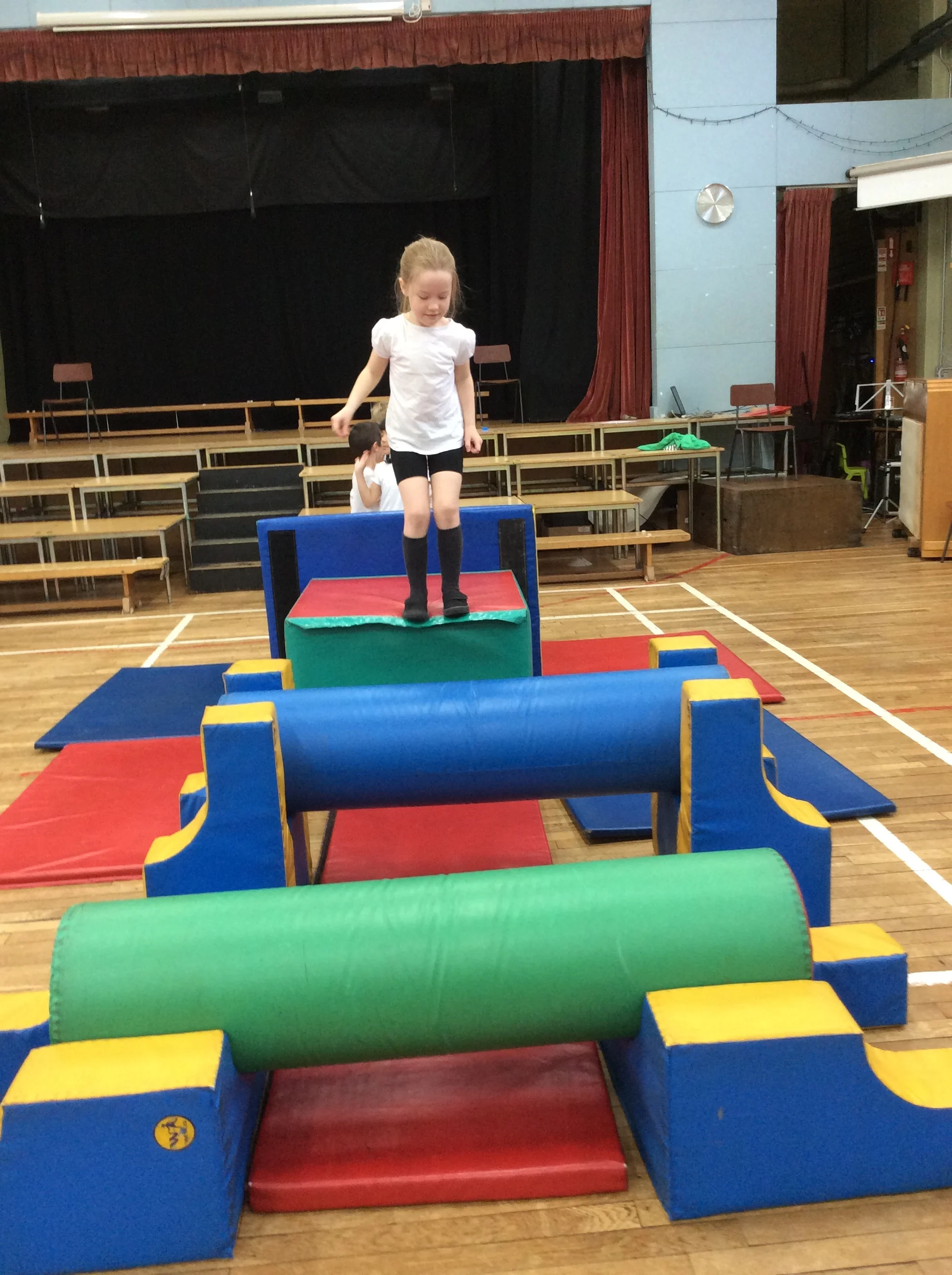 P2 are loving using the gymnastics equipment! — Holywood Primary School