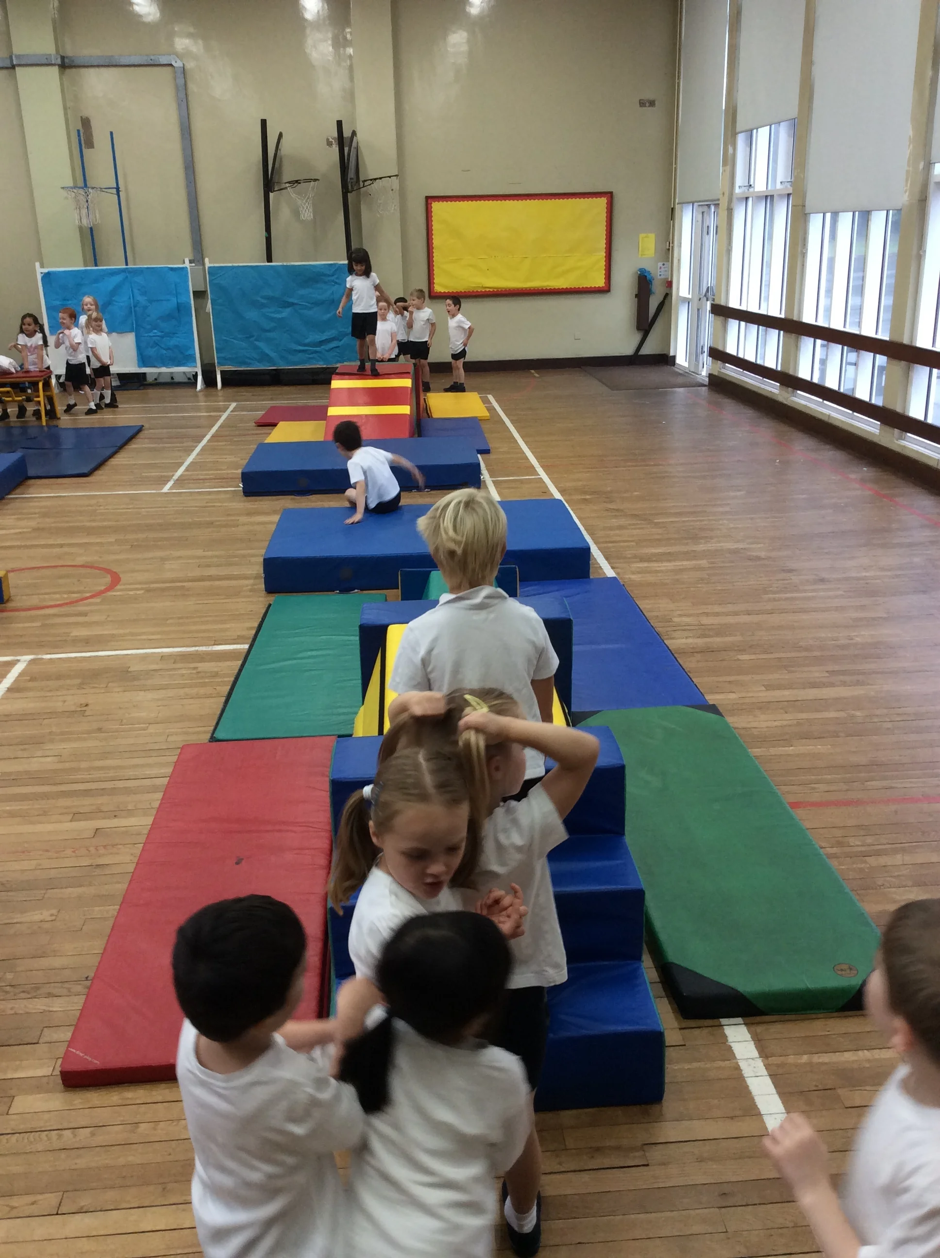 P2 are loving using the gymnastics equipment! — Holywood Primary School