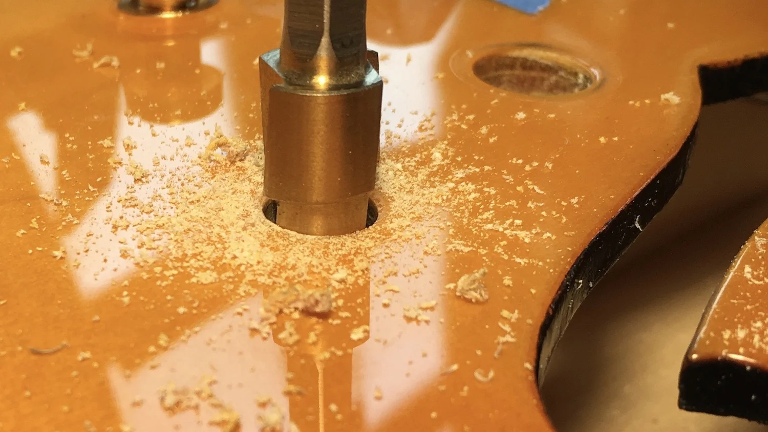 Enlarging holes for new tuners, pots, and switches — Haze Guitars