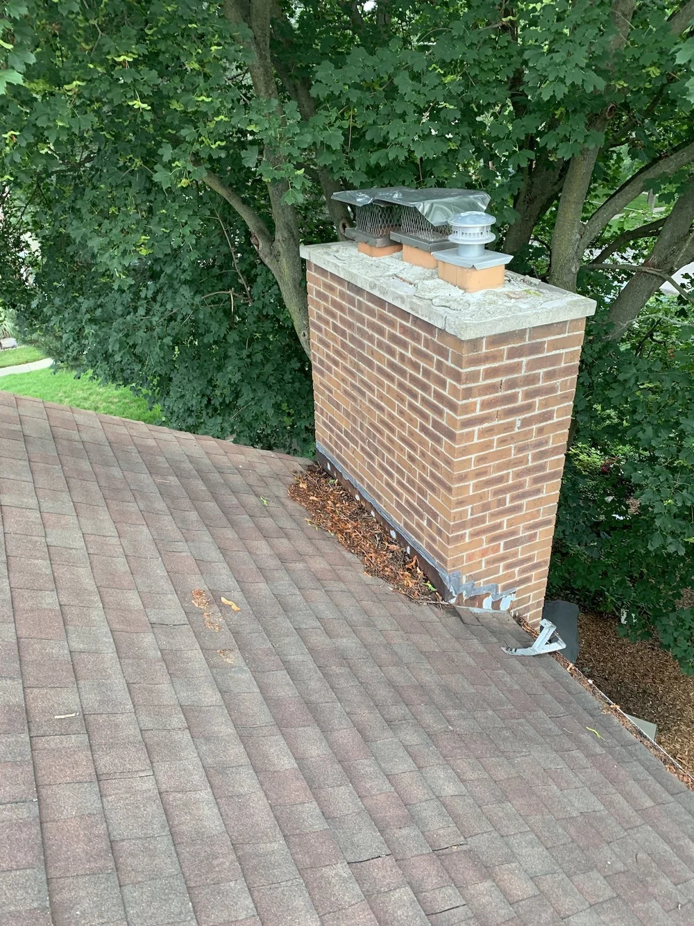 Full Roof Renovation: New Shingles, Chimney Saddle, and Gutter Covers