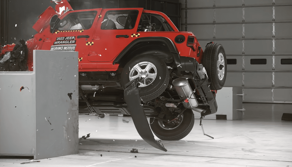 ROLL CENTRE: Jeep Wrangler flips over in official IIHS crash test - again