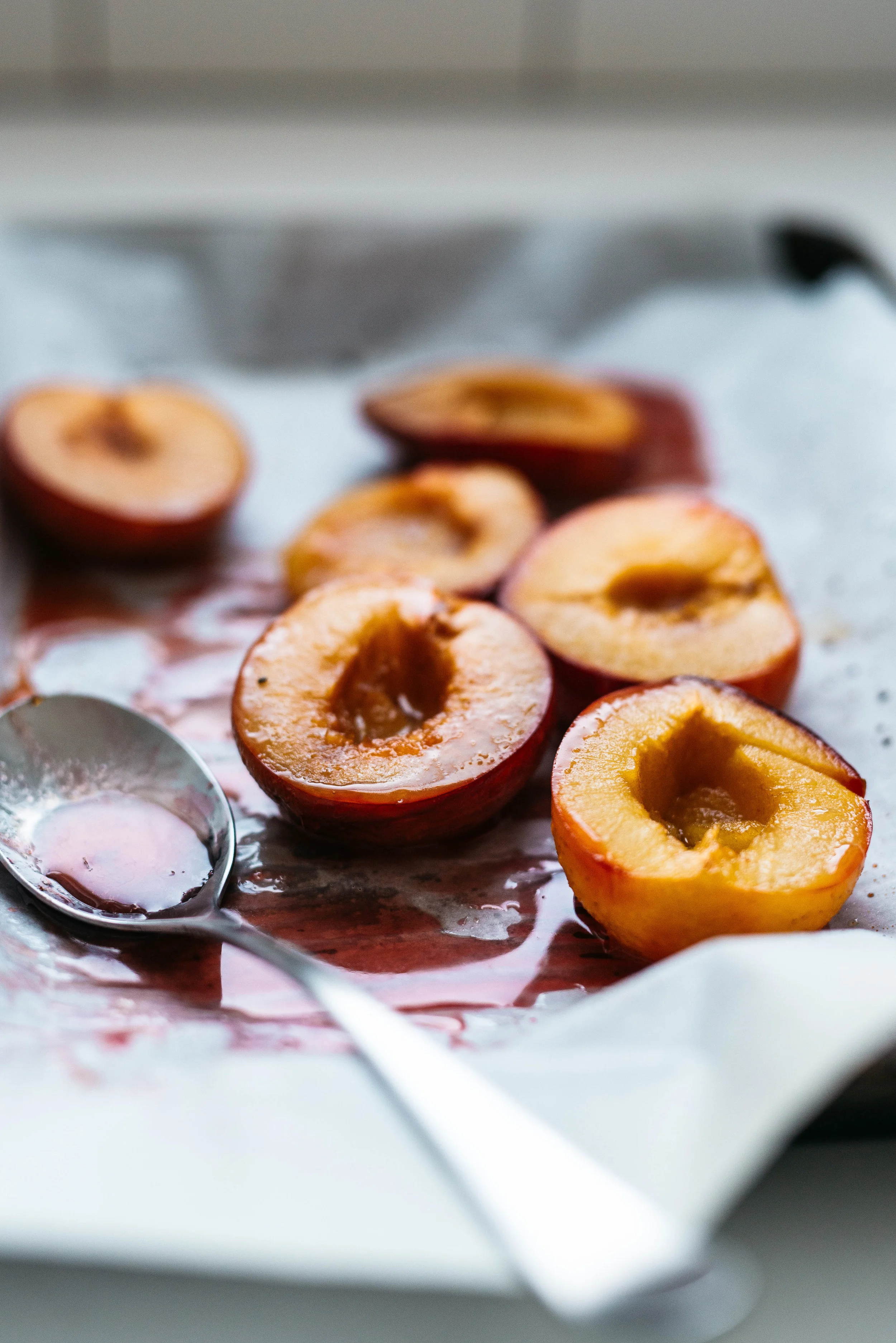 PEPITA-COCONUT GRANOLA W/ MAPLE ROASTED PLUMS — dolly and oatmeal