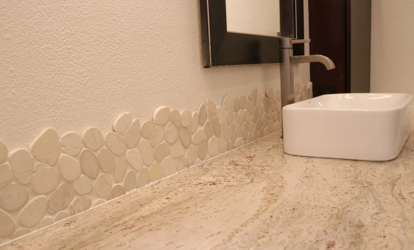 Grouting the live edge pebble tile backsplash.... — Beckwith's Treasures