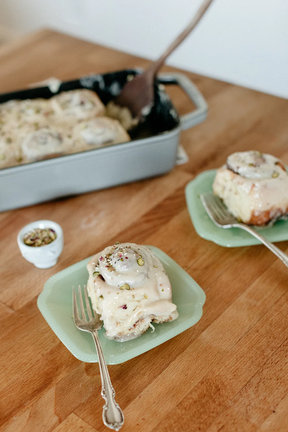 overnight cinnamon rolls with tahini cream frosting and pistachio rose ...