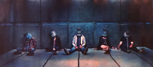 New Photo For JIGSAW Shows People With Buckets On Their Heads? — GeekTyrant