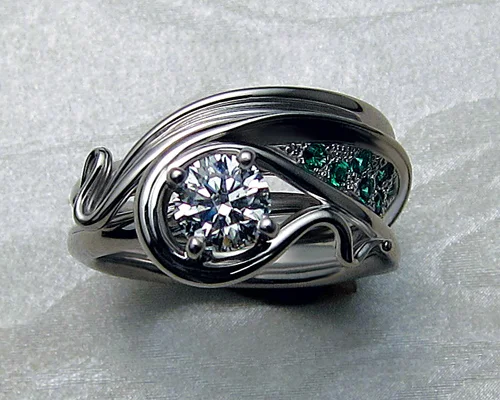 Asymmetrical, free-form, engagement ring, with diamond and emeralds ...
