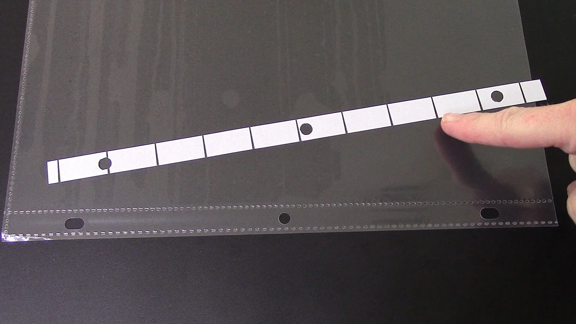 How to Apply Hole Reinforcement Strips (Overhead View)