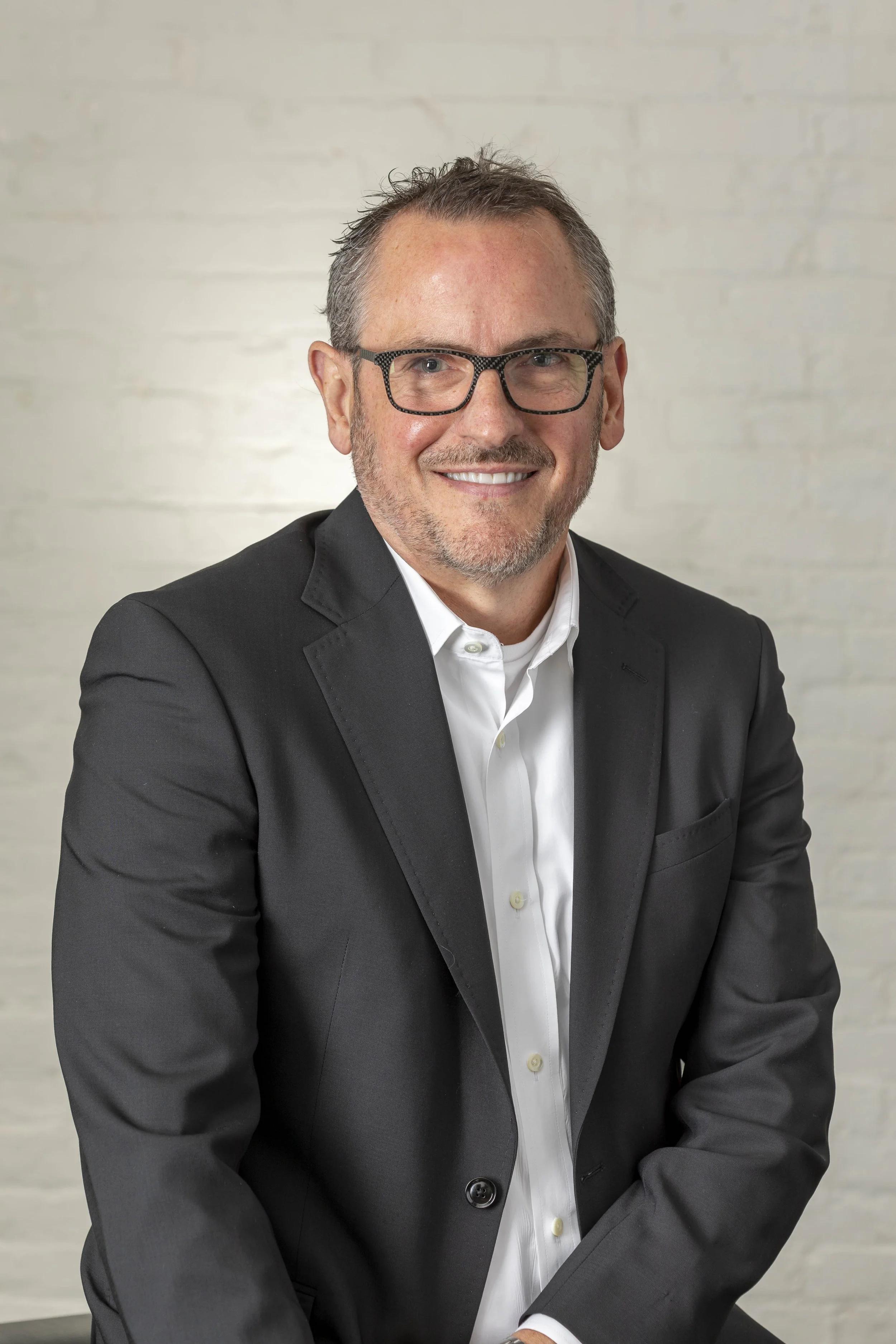 Executive Profiles — Martin Smith Inc