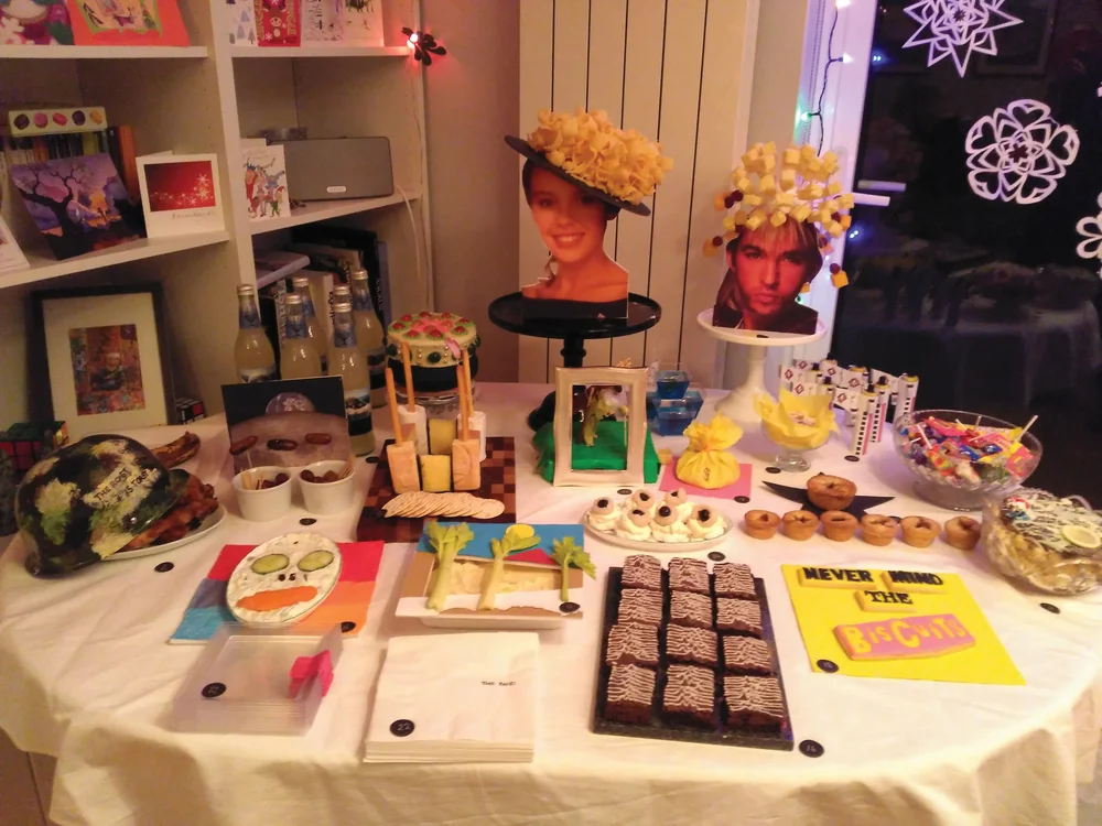 An "iconic album cover" themed buffet table.