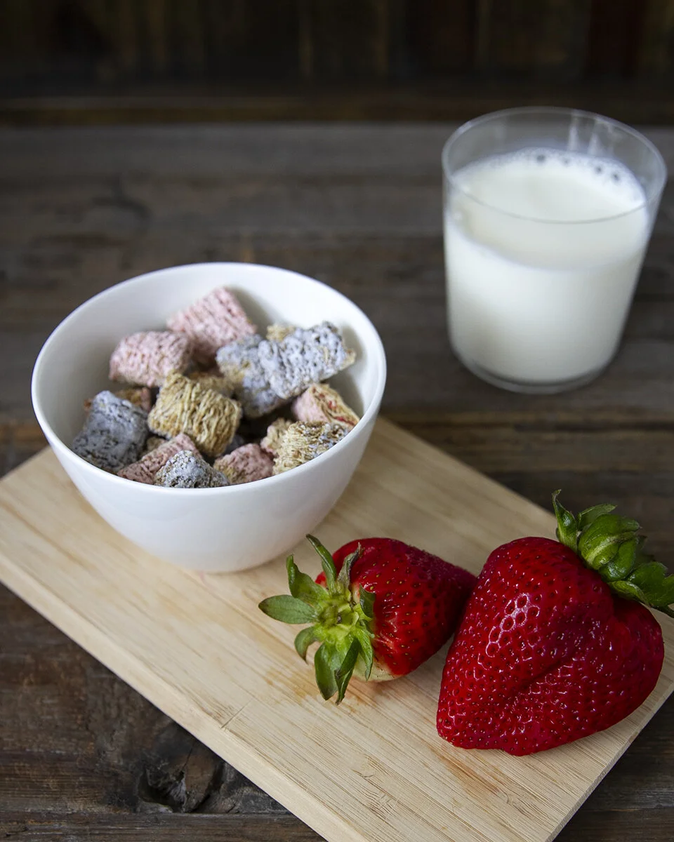 frosted mini wheats cereal w/ giant strawberriest-square in the kitchen