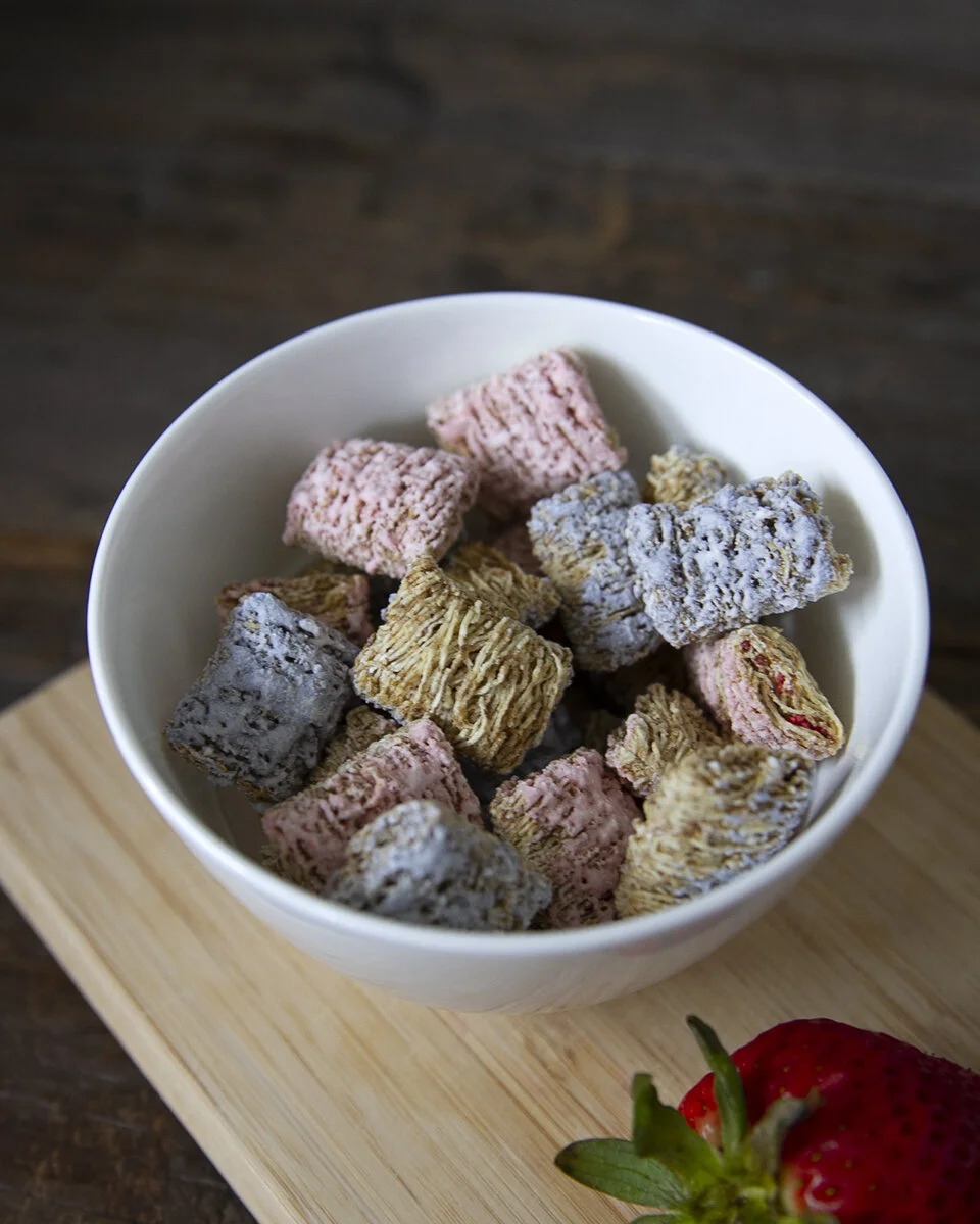 frosted mini wheats cereal w/ giant strawberriest-square in the kitchen