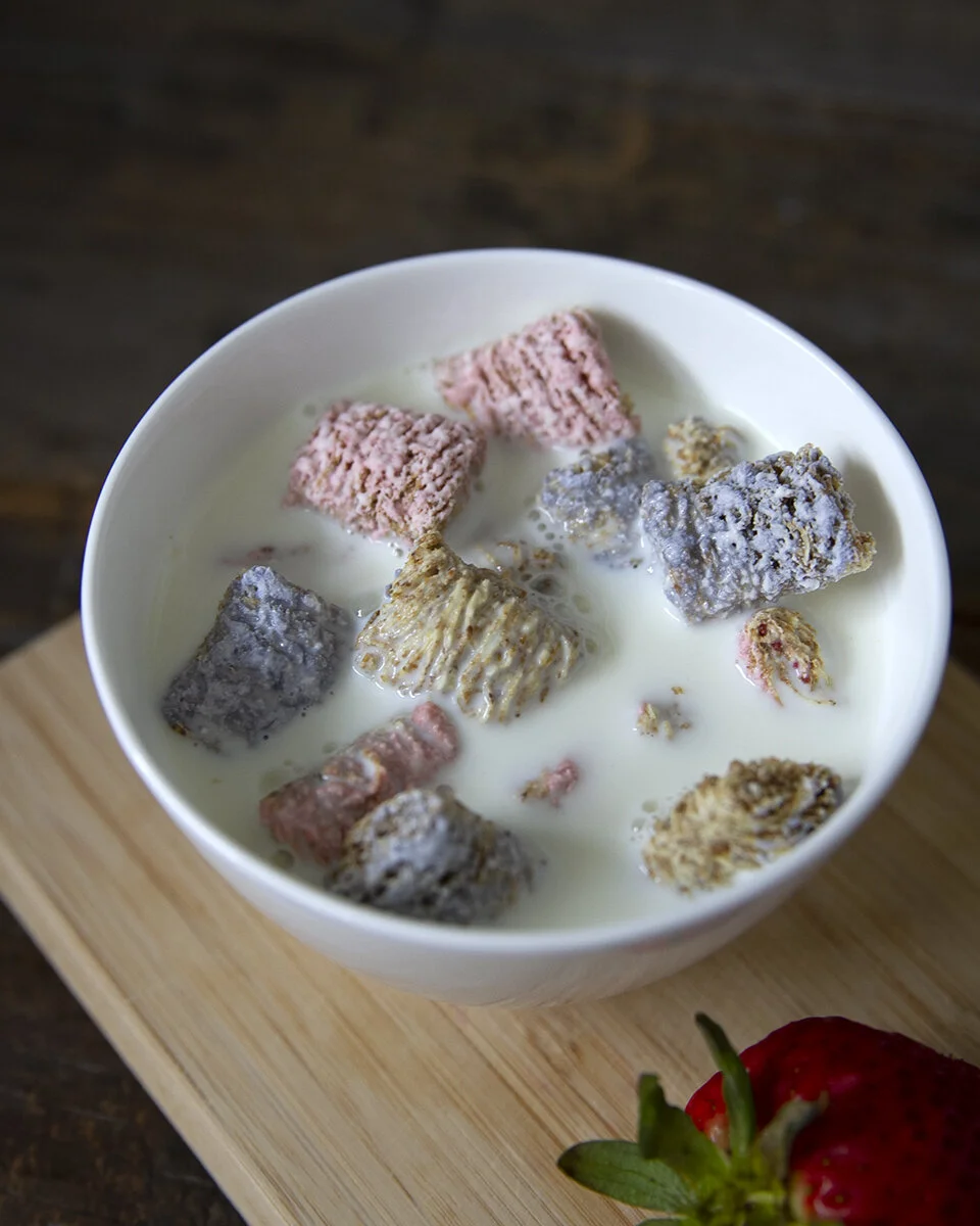 frosted mini wheats cereal w/ giant strawberriest-square in the kitchen
