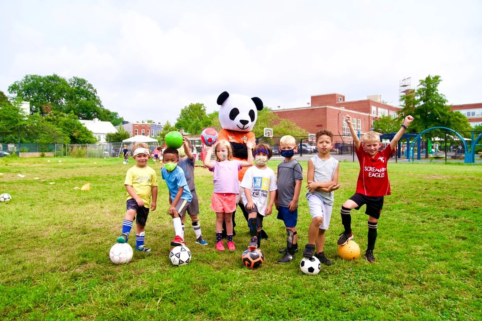 Kids Playing Soccer At School