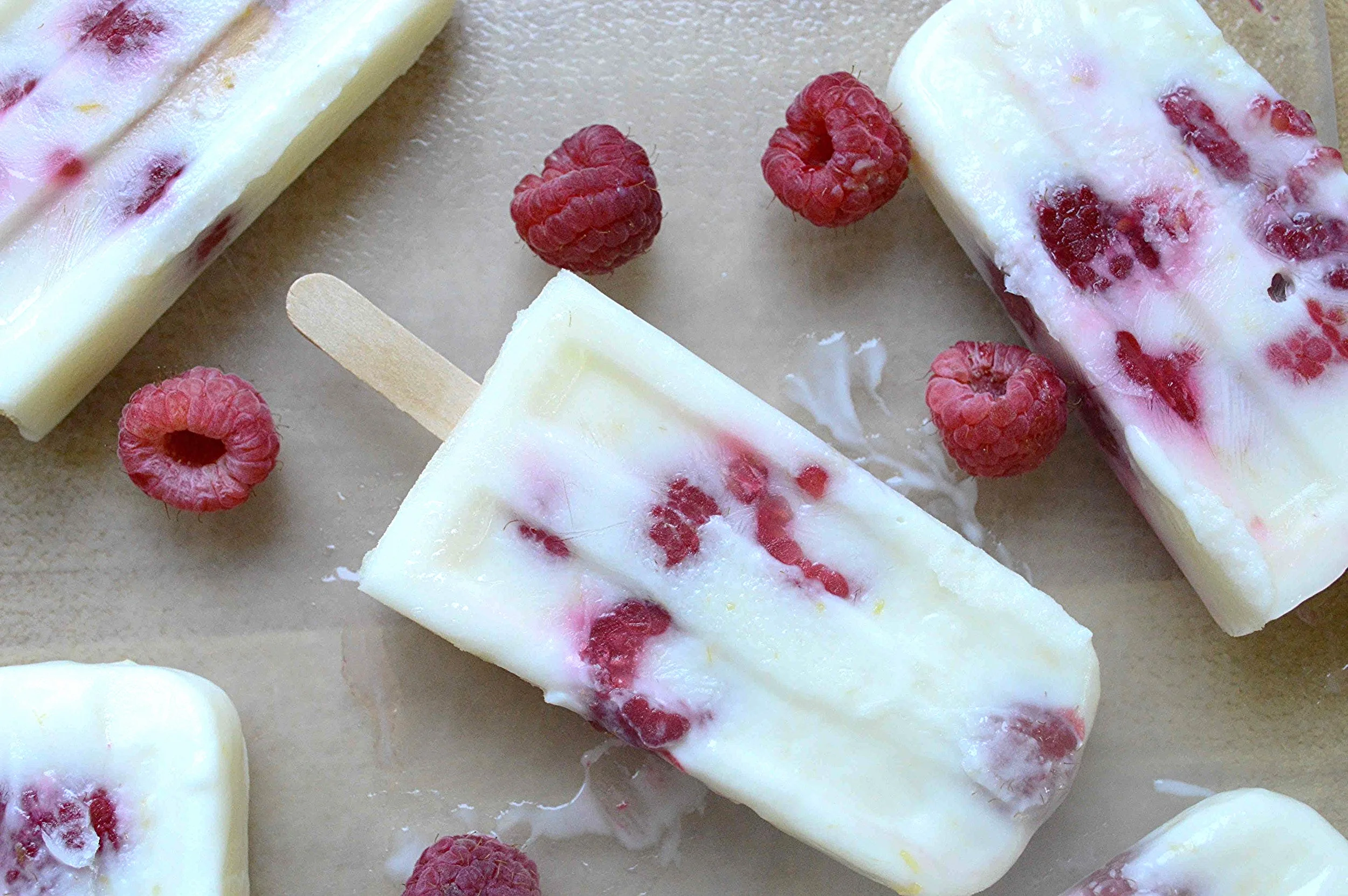 Creamy Raspberry Lemonade Popsicles — Unwritten Recipes