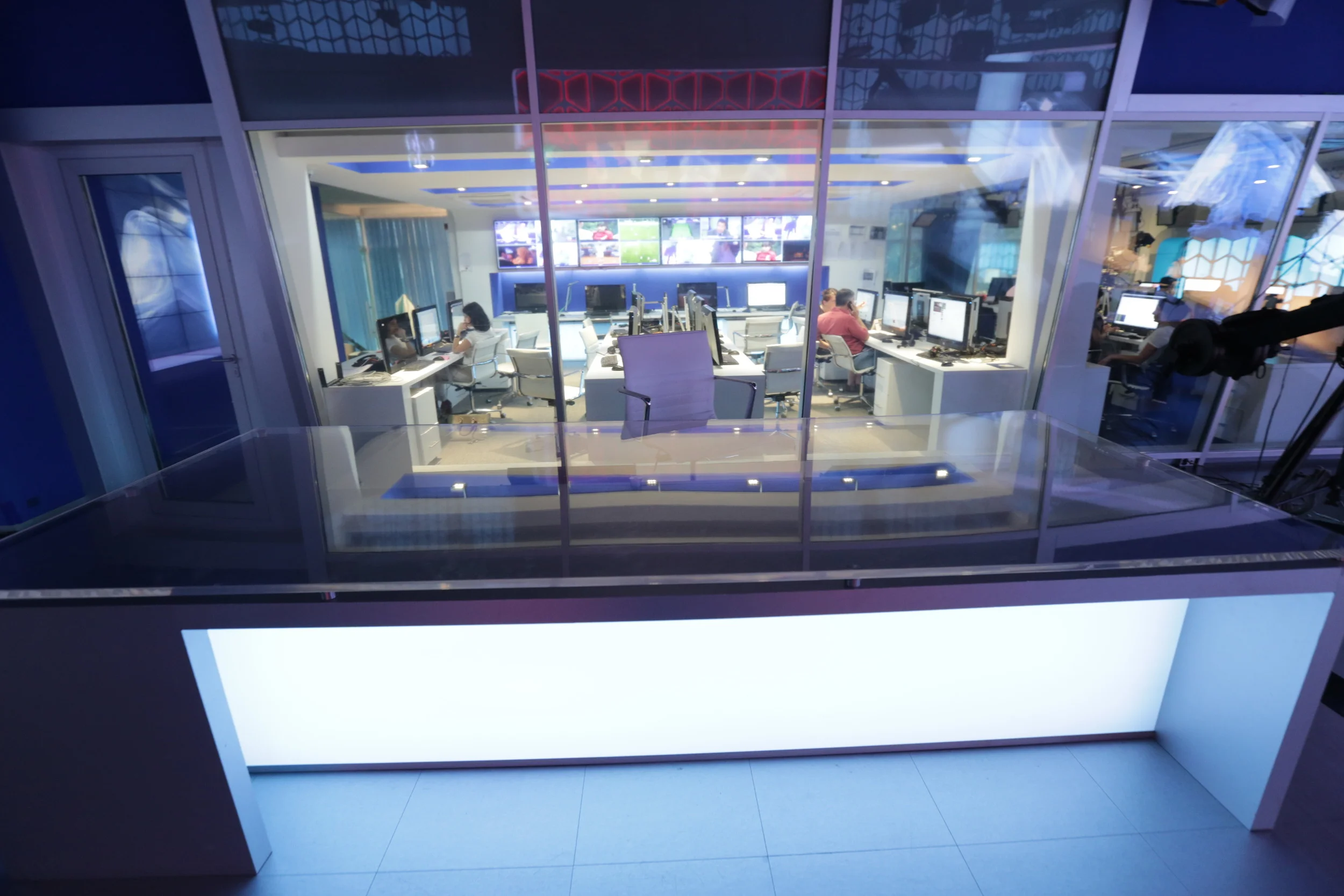 TV-9 Branded Broadcast Newsroom Design and Office Interior — PROVOST STUDIO