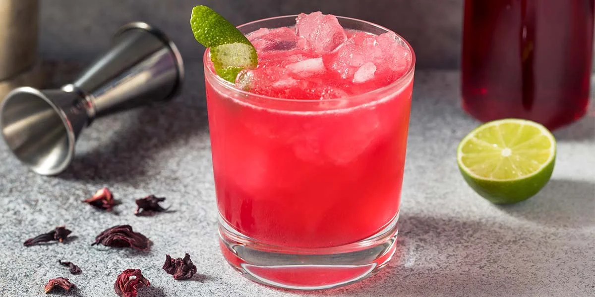 This bright red gin cocktail is made with hibiscus syrup and citrus ...