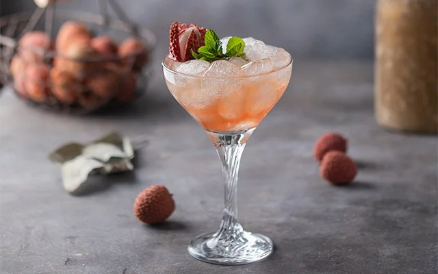 Lychee, sparkling white wine and gin come together in this stunning ...