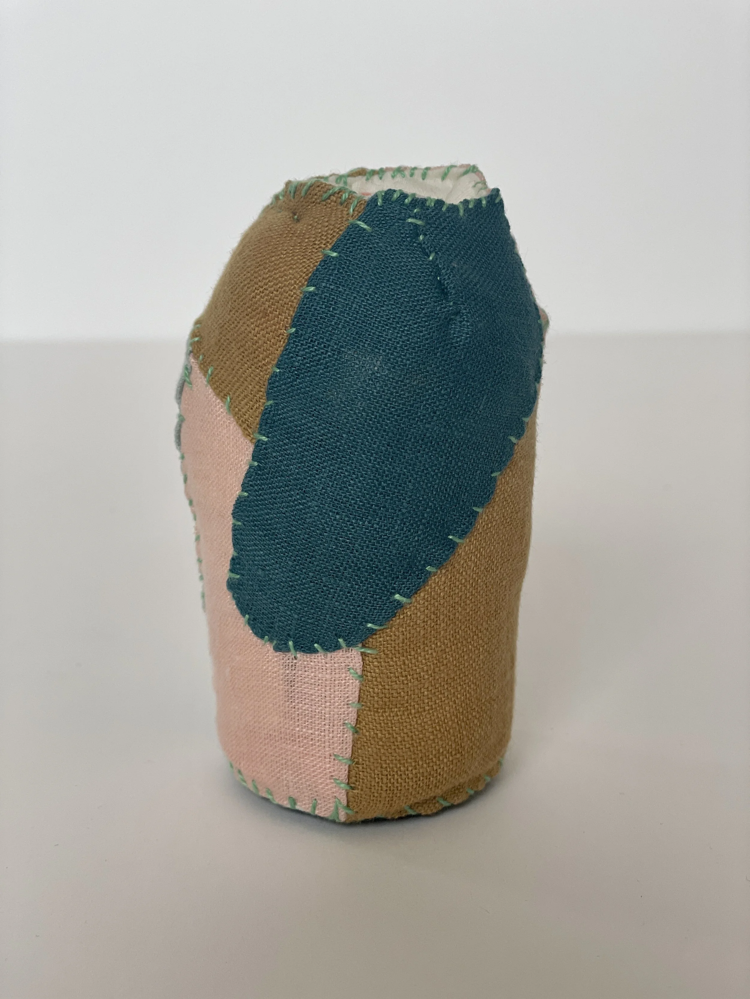 A tiny quilted vase or vessel that is both functional and a work of art ...