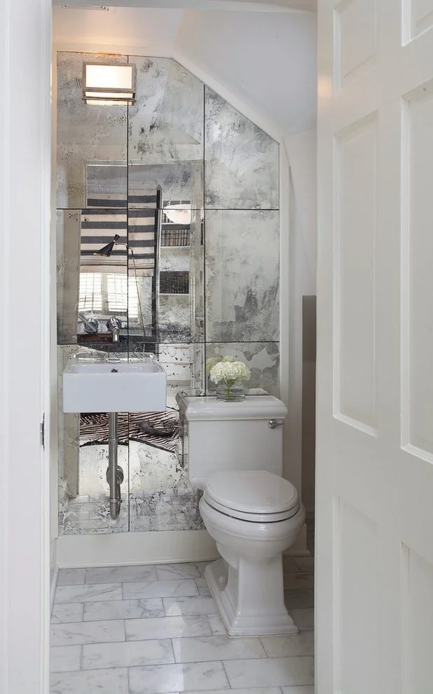 adding drama to a tiny powder room — toronto designers