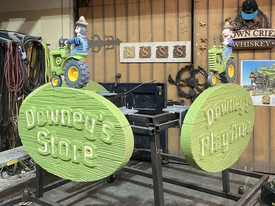 Base coats on Downey's signs — Imagination Corporation