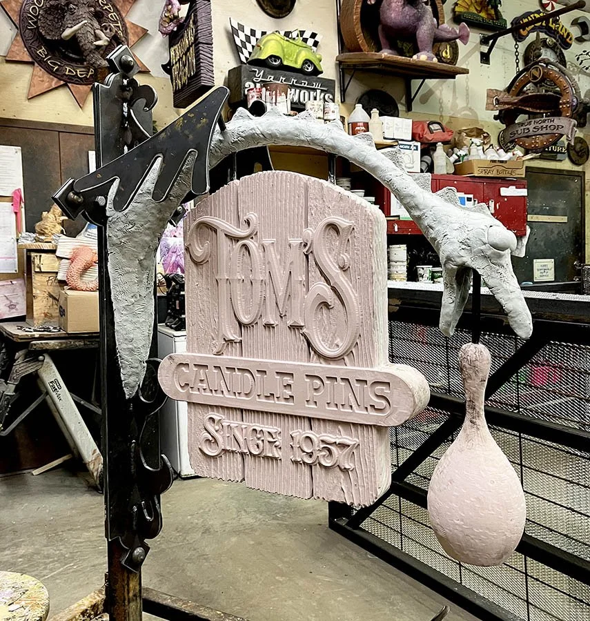 Sculpting a dragon sign — Imagination Corporation