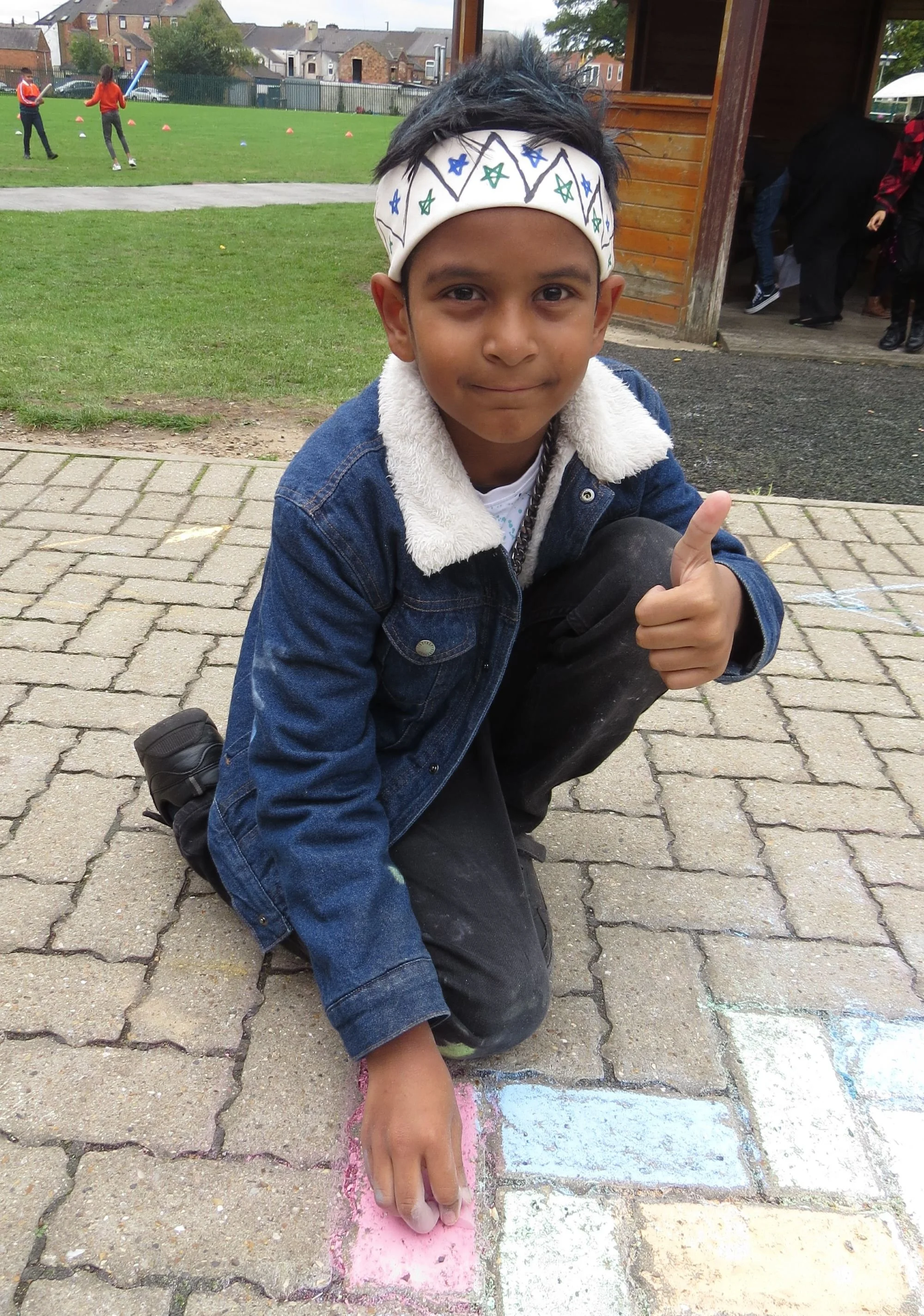 School children chalking up colourful playtimes with the help of ...