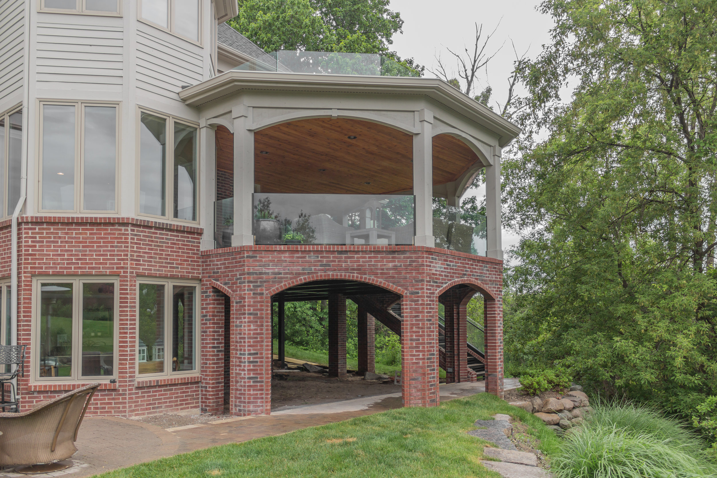 Tri-level pavilion with brick archways and endless views — VENTURES