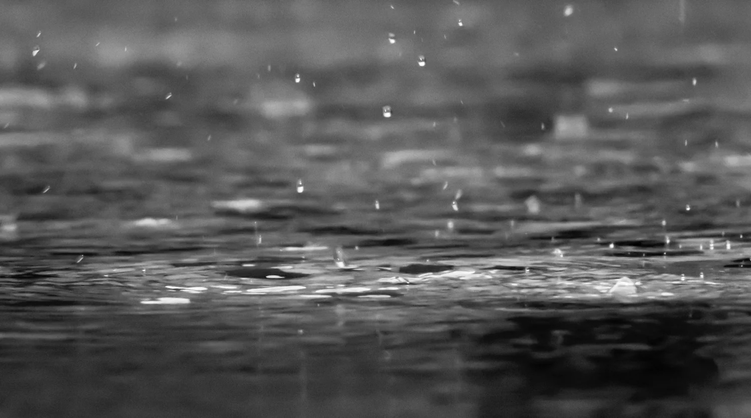 What happens when a raindrop hits a puddle?