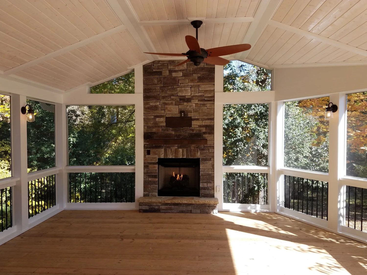 Screened Porch with Fireplace and Wall Sconces