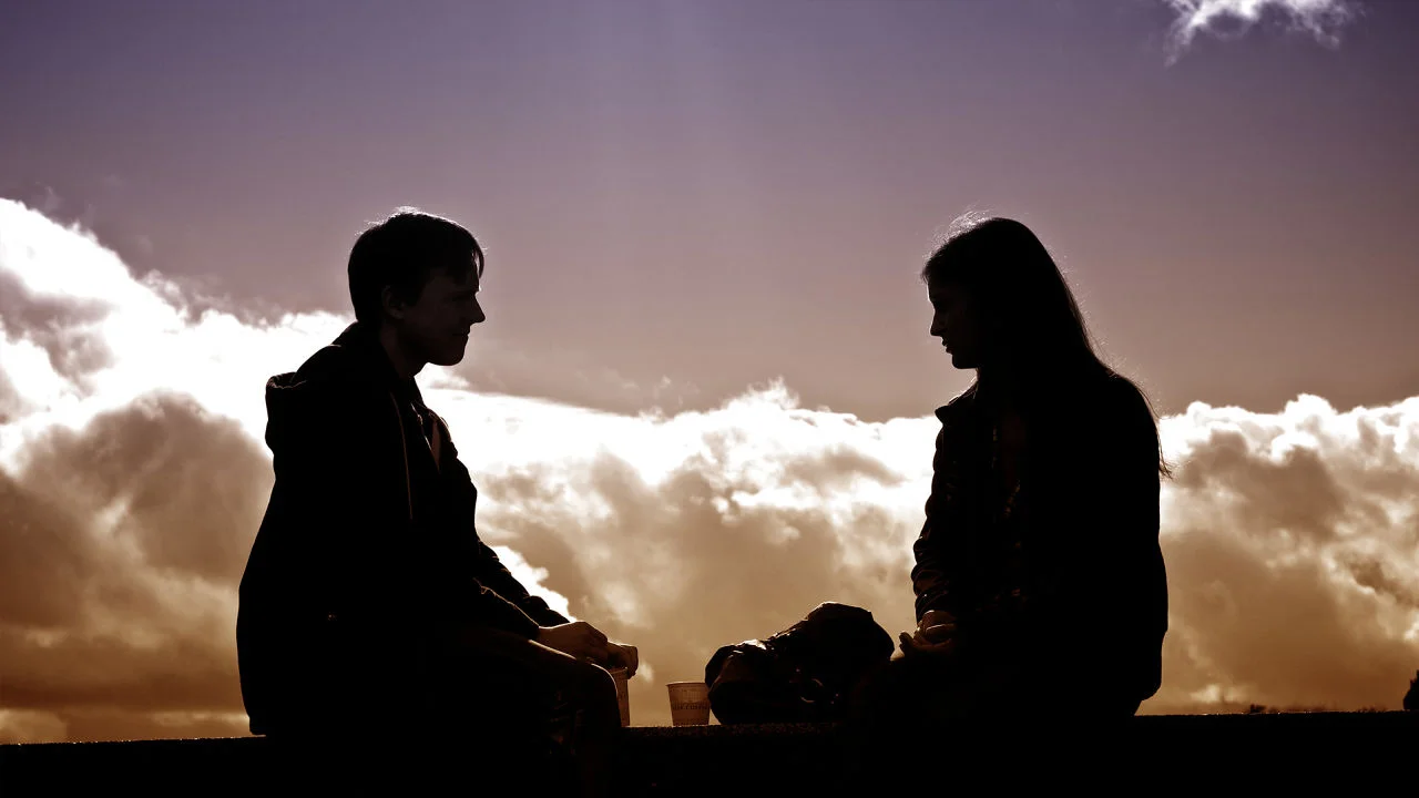 Two People Listening To Each Other