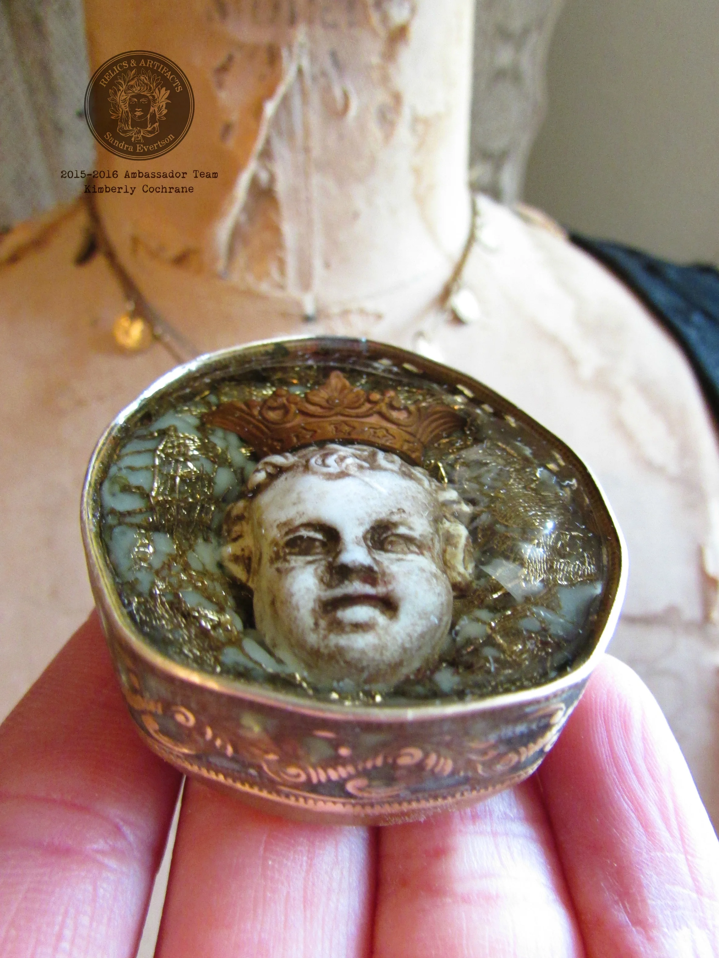 A Crowned Cherub Relic Pendant with RELICS & ARTIFACTS® Ambassador ...