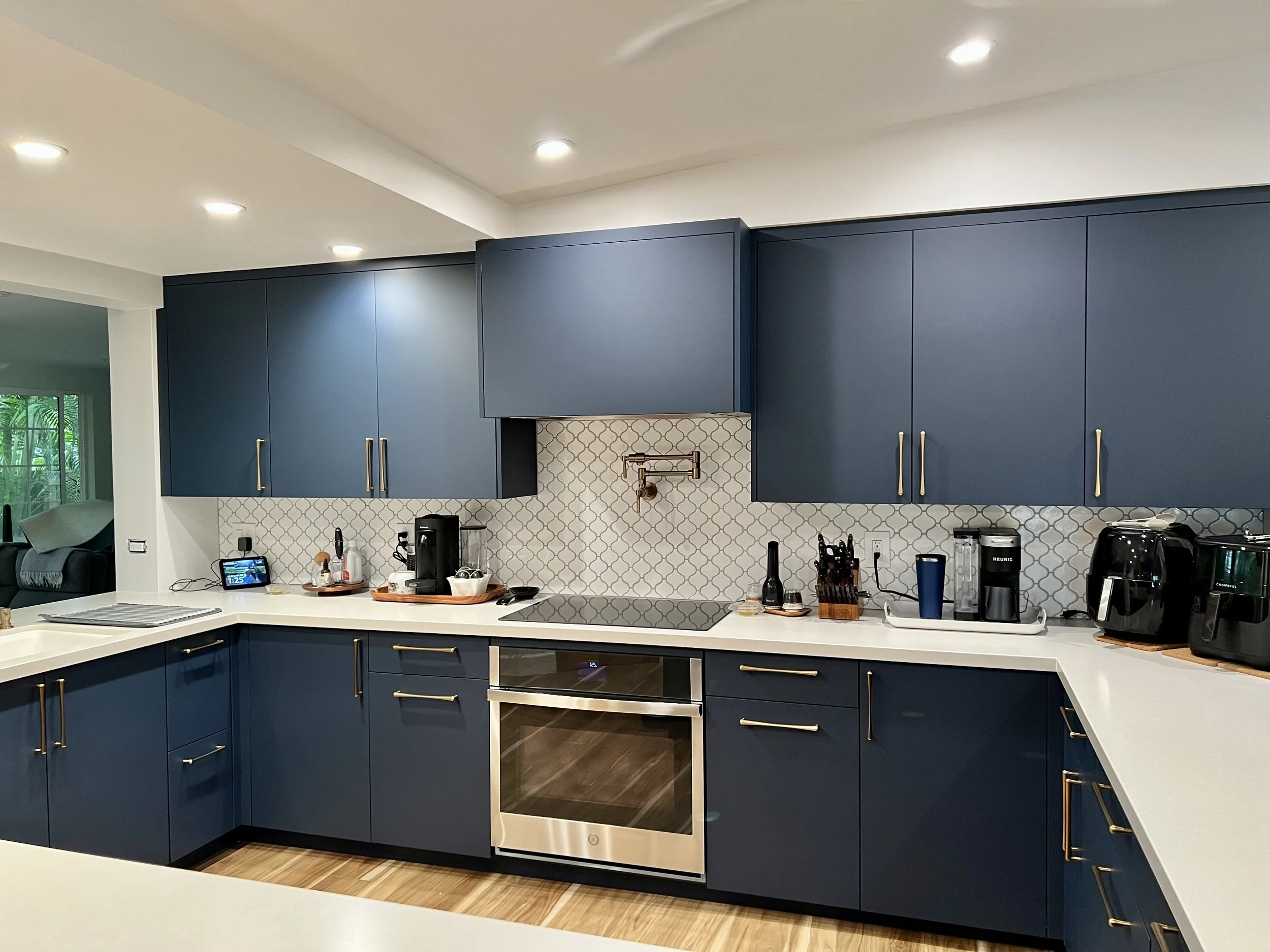 A gallery of various spaces showcasing cabinets and countertops ...