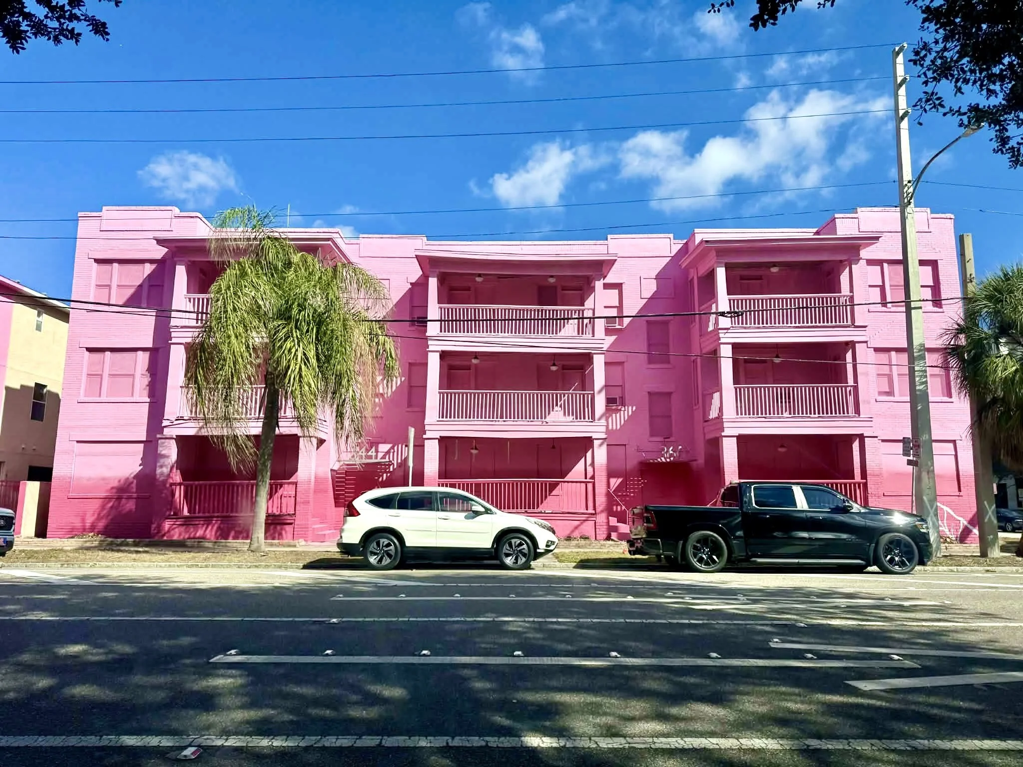 Downtown St. Pete apartments painted pink before demolition makes way ...