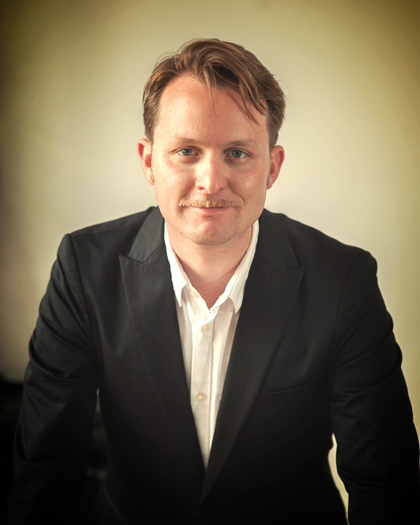 Bio — Samuel McCoy Conductor