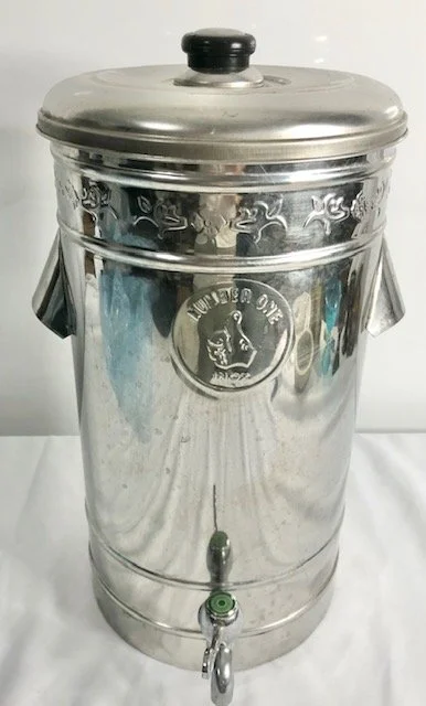 Silver drink dispenser — Celebration Set Ups