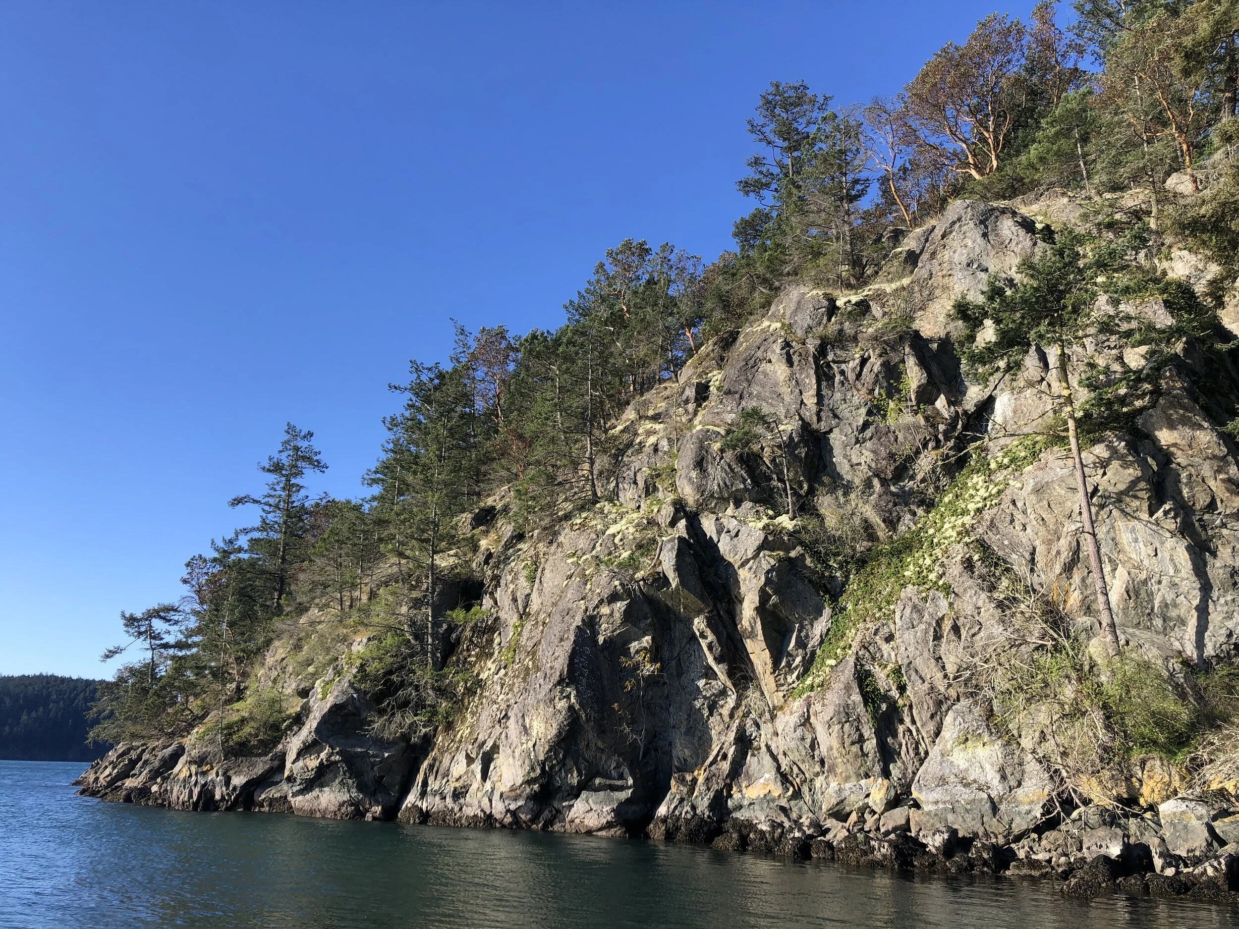 Waterfront Modern House steps down a rock bluff — Nina Le Baron, AIA