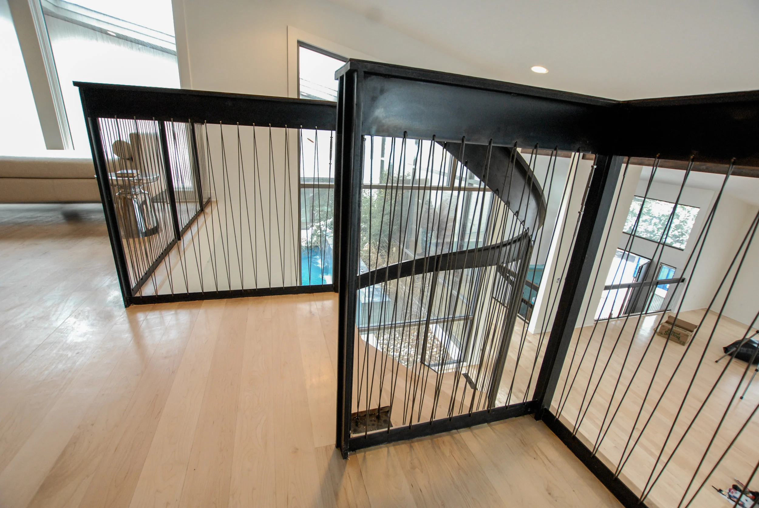 Spiral Staircase with Leather Handrail and Woven Cables — Custom Metal ...