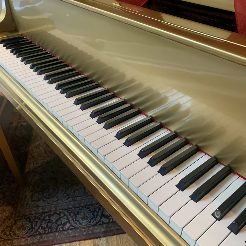 White And Gold Grand Piano