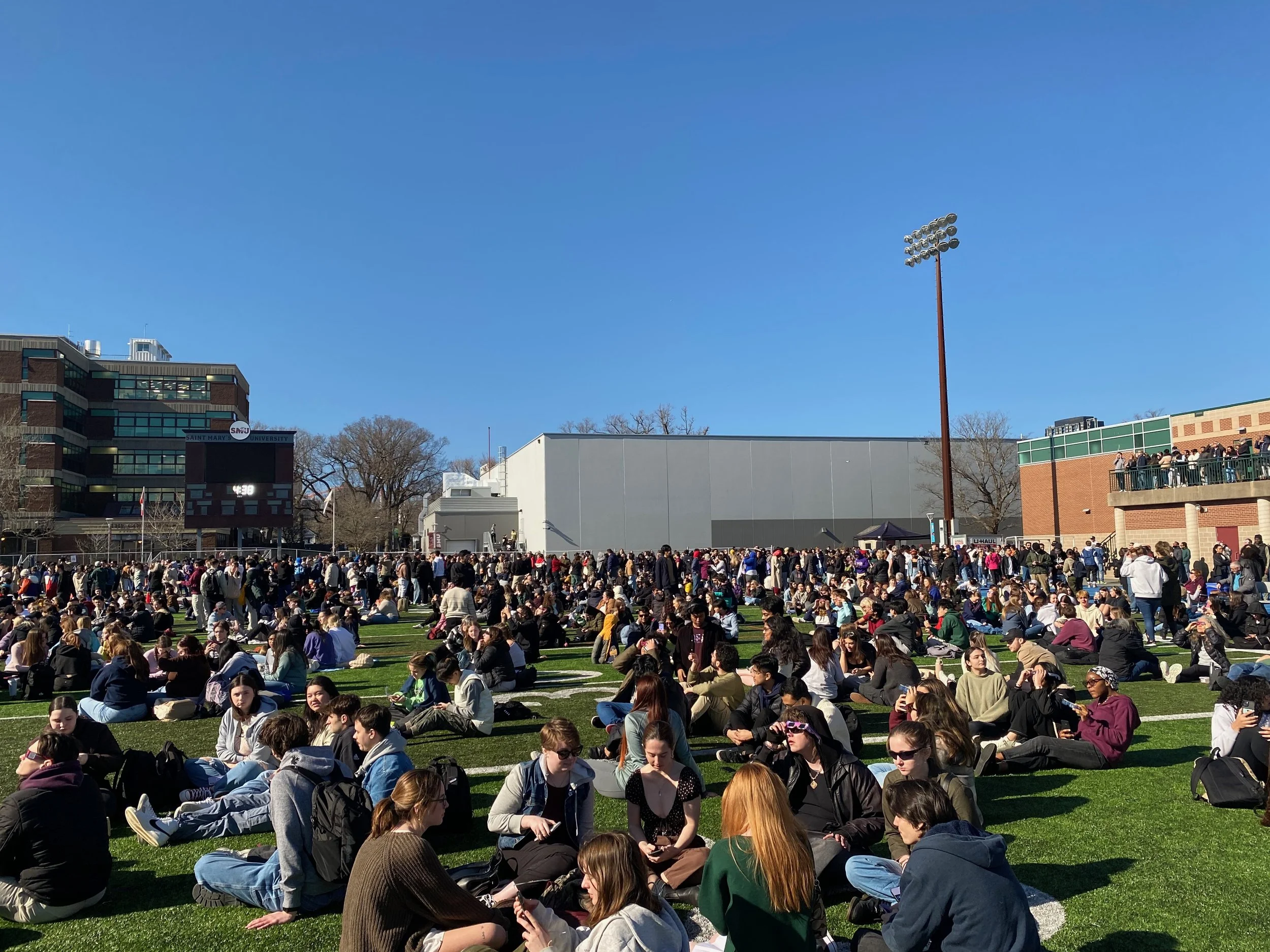 Thousands gather on SMU Huskies field for solar eclipse event | SMU ...