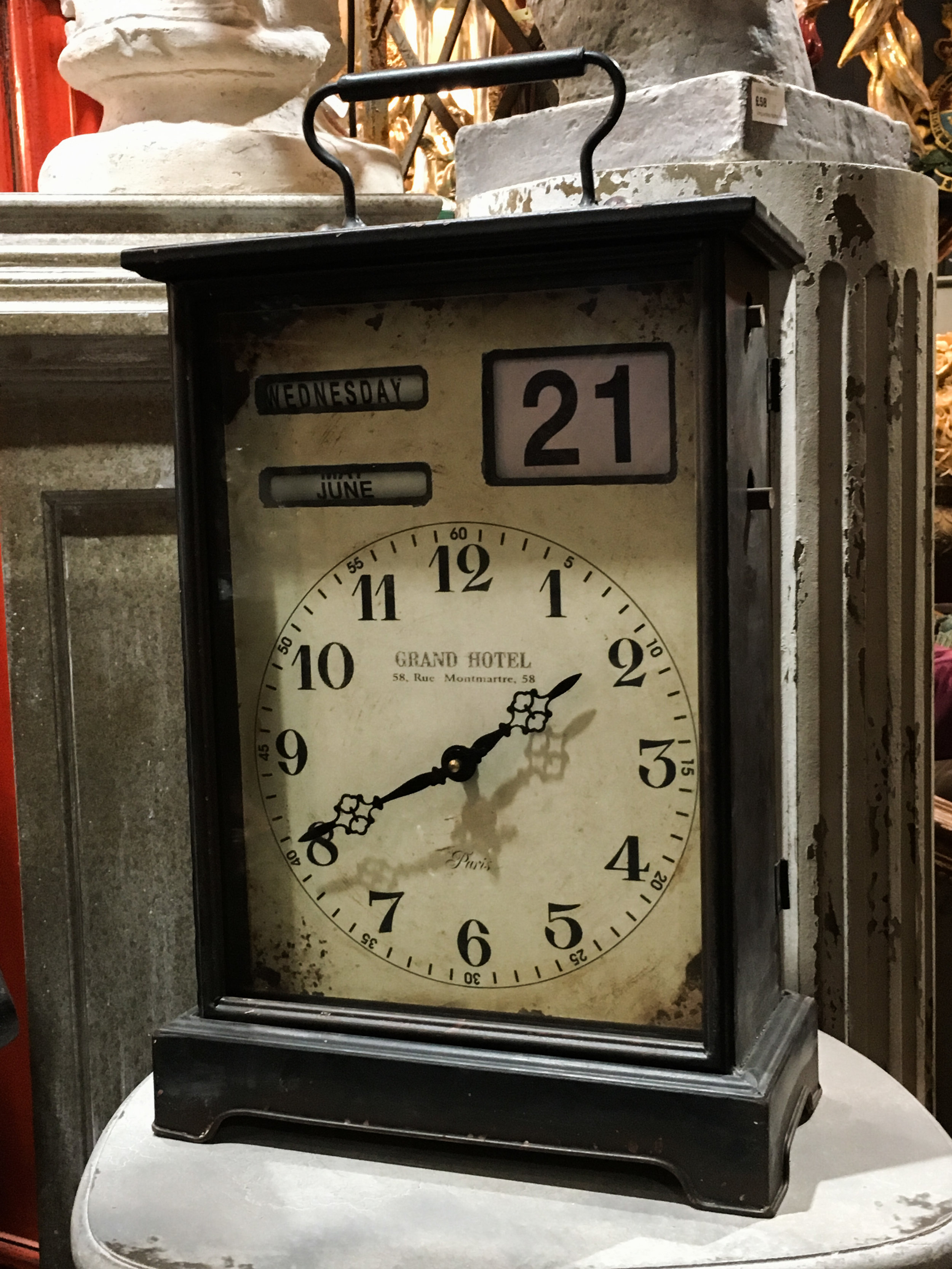 An industrial looking "Grand Hotel" mantle clock