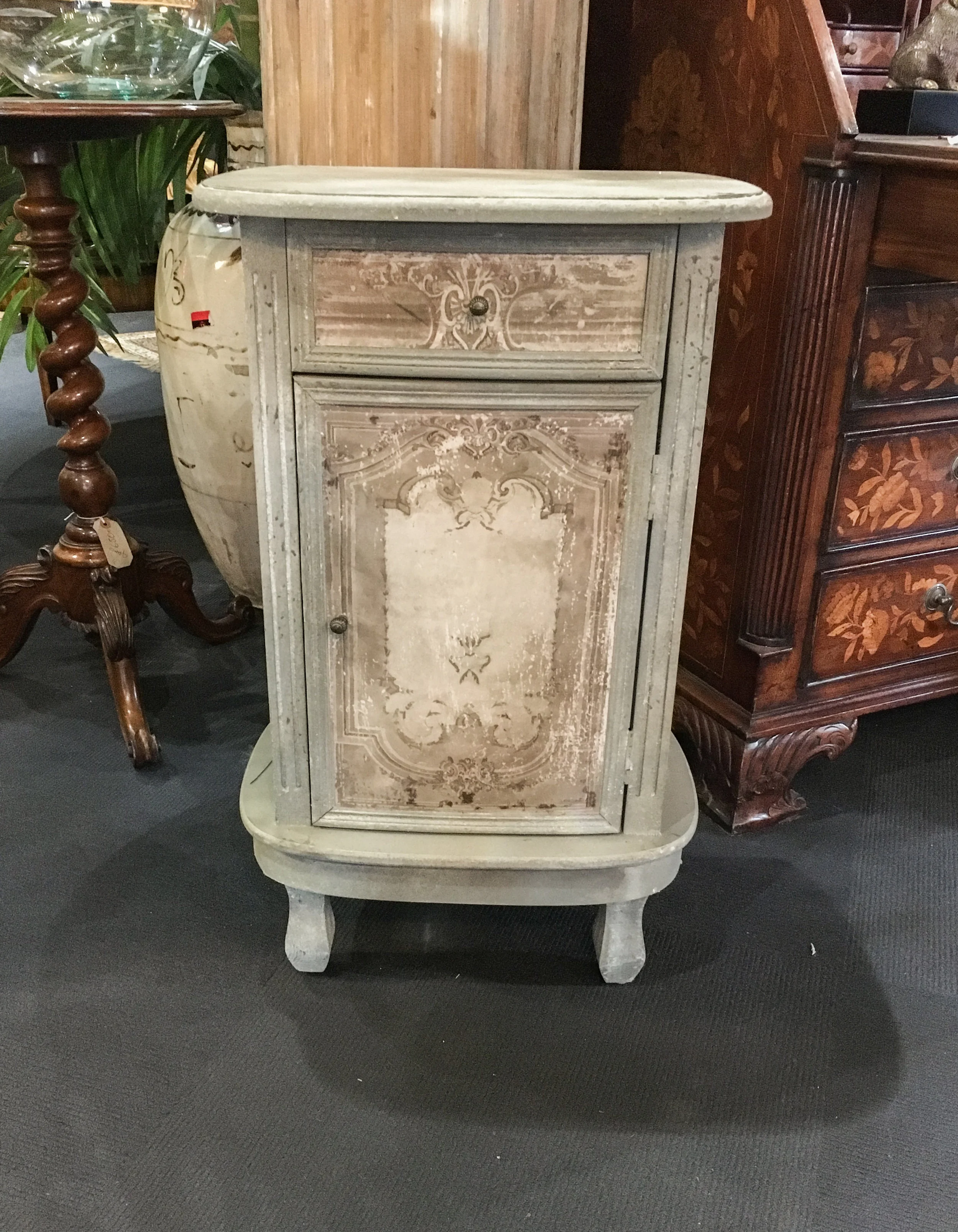 A pretty bedside cabinet with drawer and cupboard
